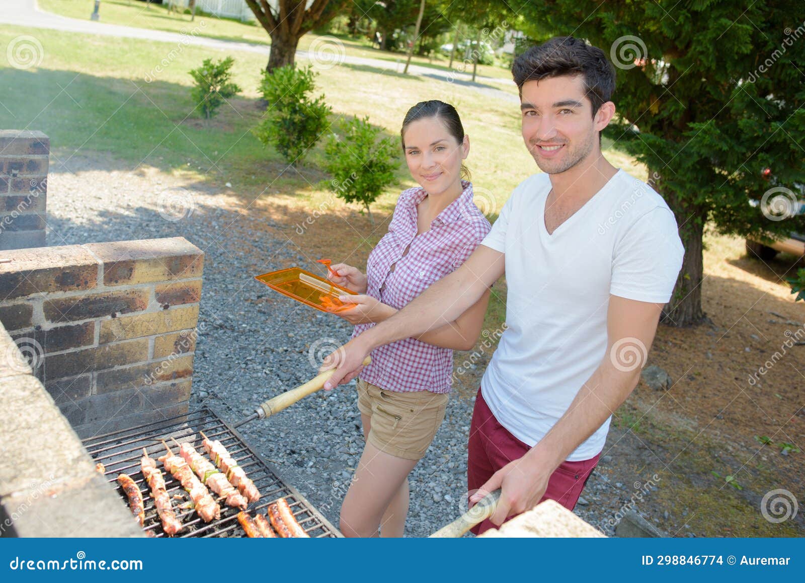 Happy Couple Doing Summer Barbecue Stock Photo - Image of garden ...