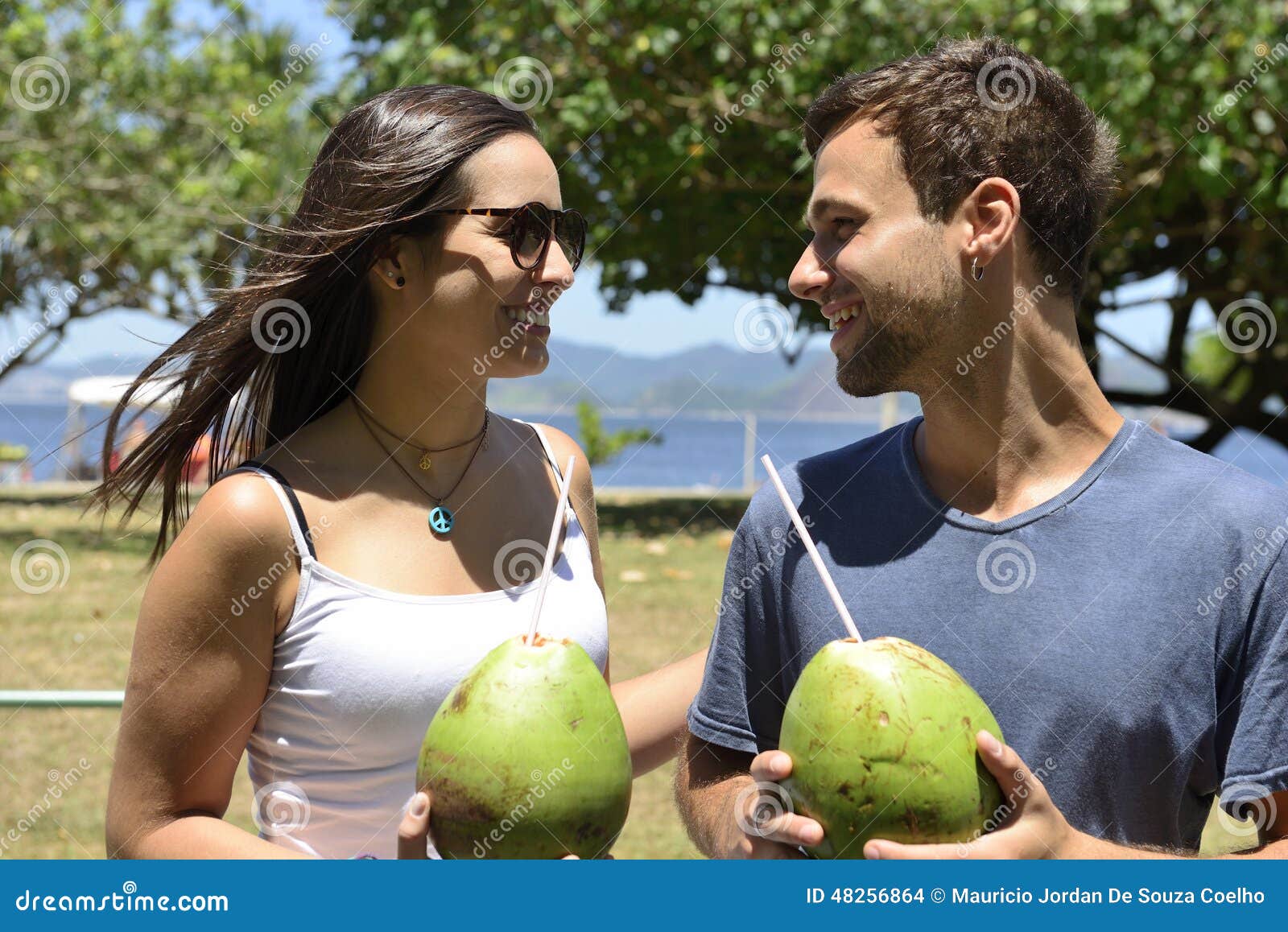 Happy Couple Drinking Coconut Water Stock Photo - Image of girlfriend ...