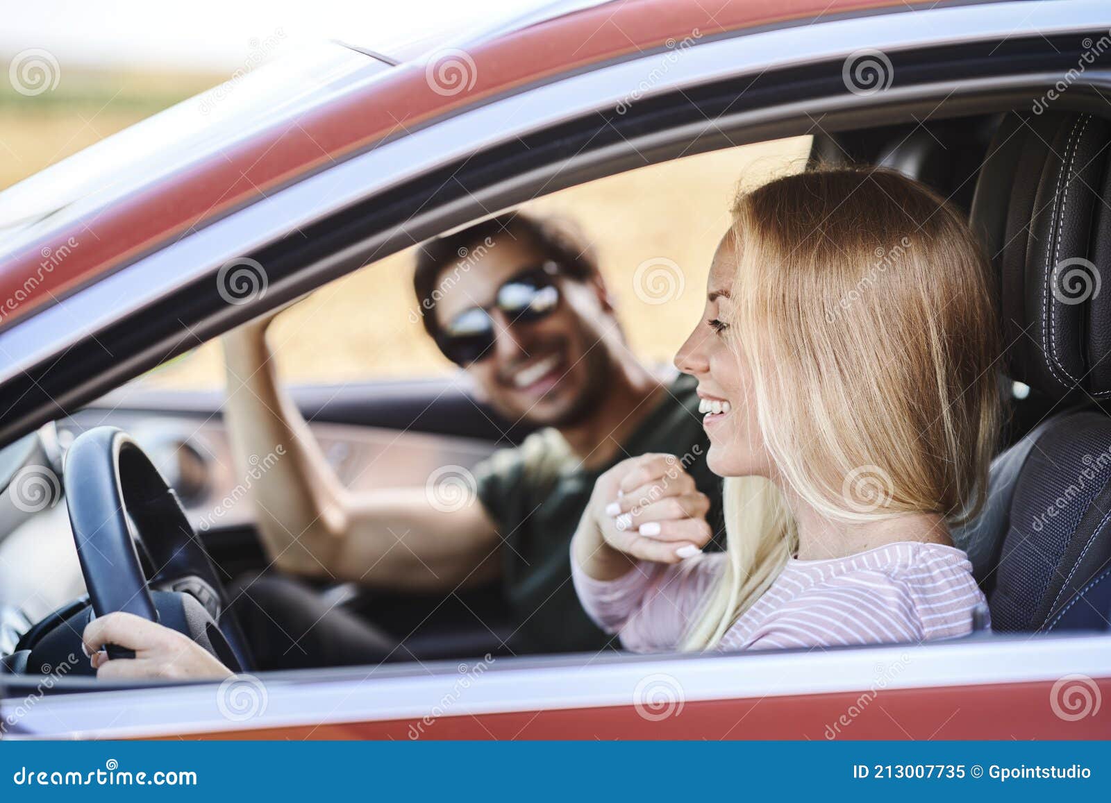 Couple driving in the car stock image. Image of long - 213007735