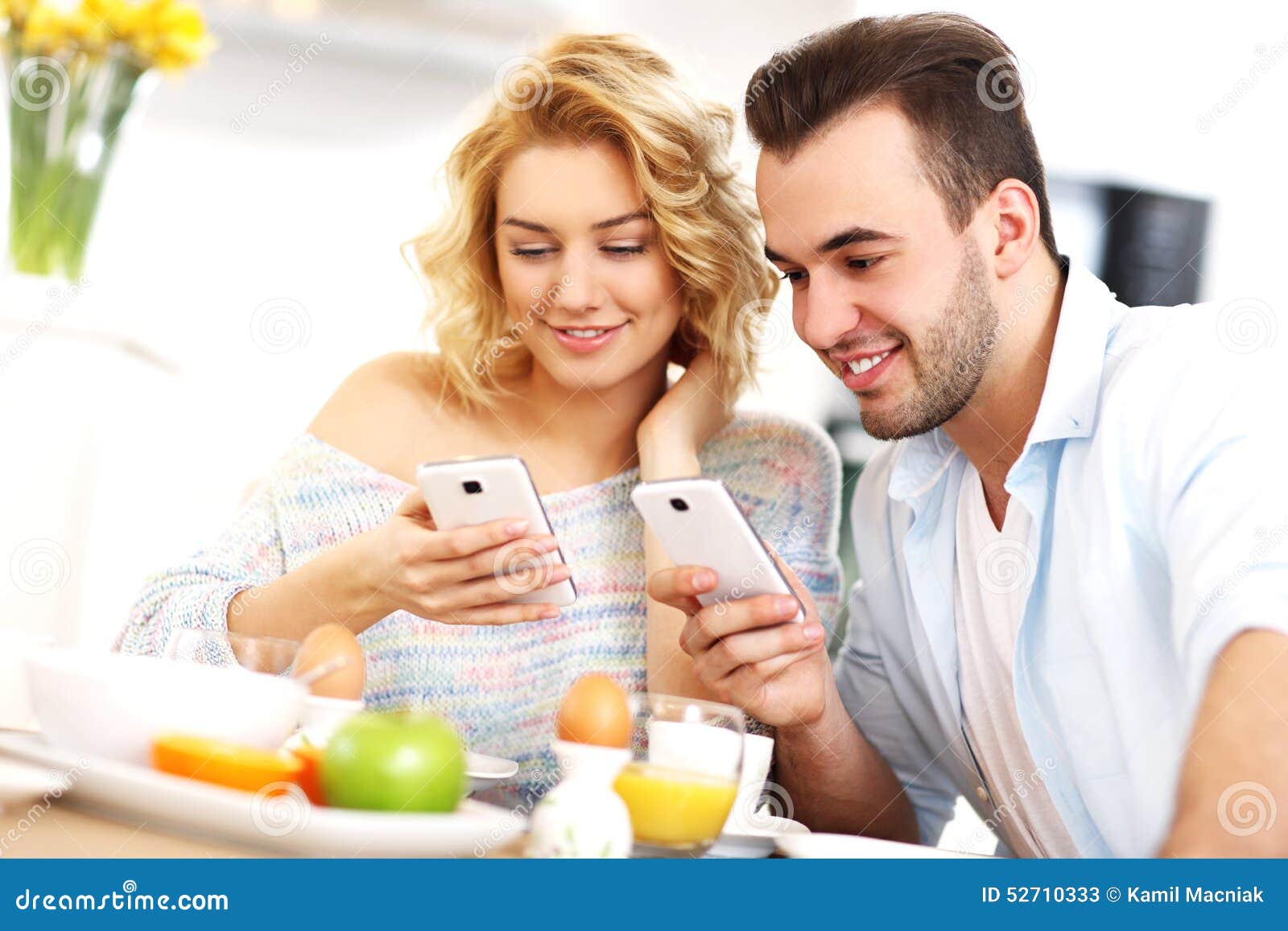 Happy Couple Eating Breakfast and Using Smart Phone Stock Image - Image ...