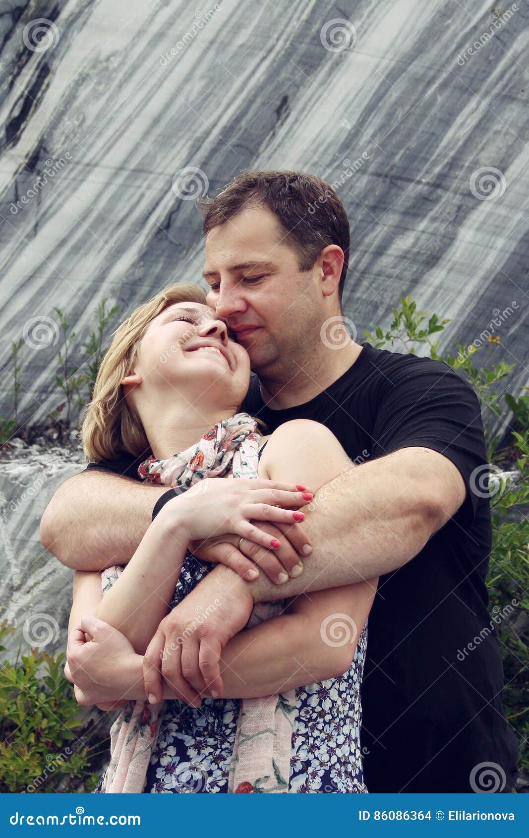 Happy couple embracing. stock photo. Image of together - 86086364
