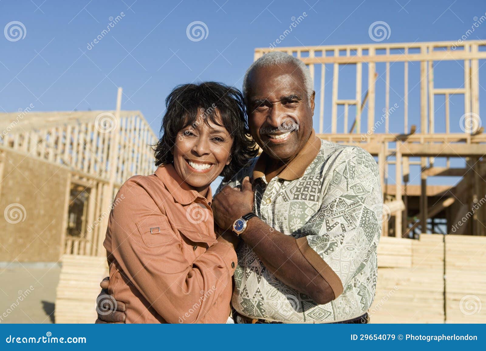 Happy Couple in Front of Incomplete House Stock Image - Image of ...