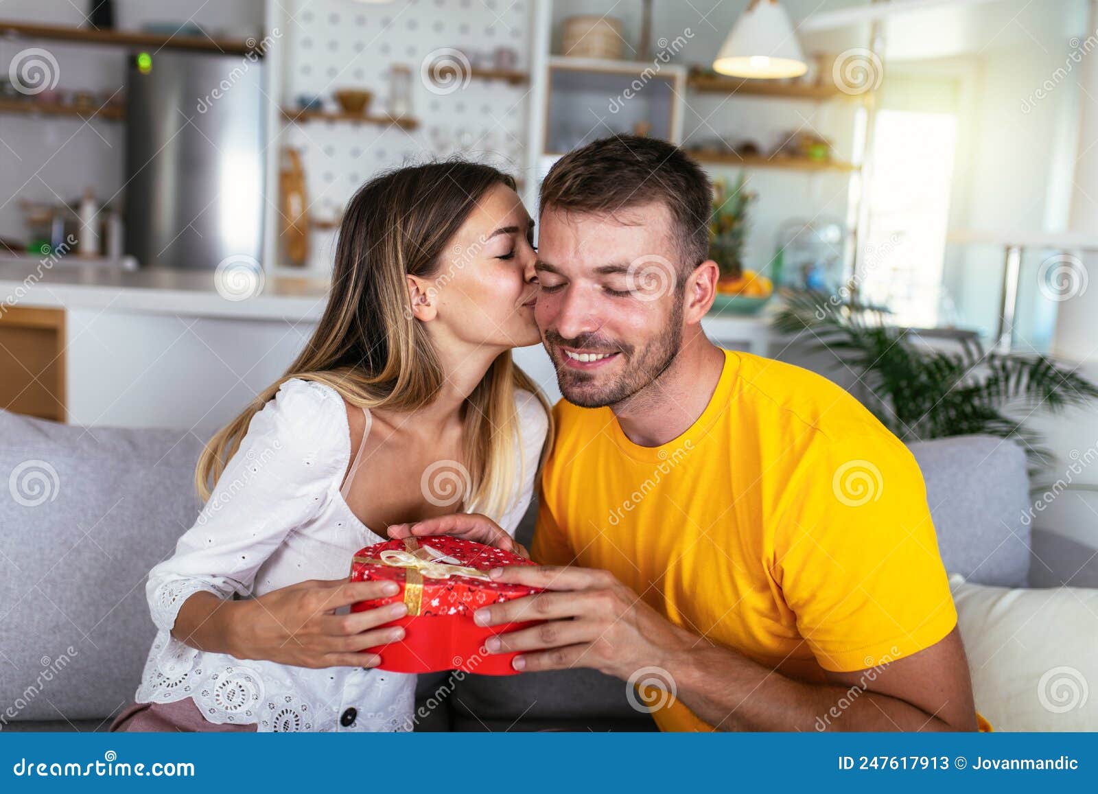Couple with Gift Box Hugging at Home Stock Image - Image of expression ...