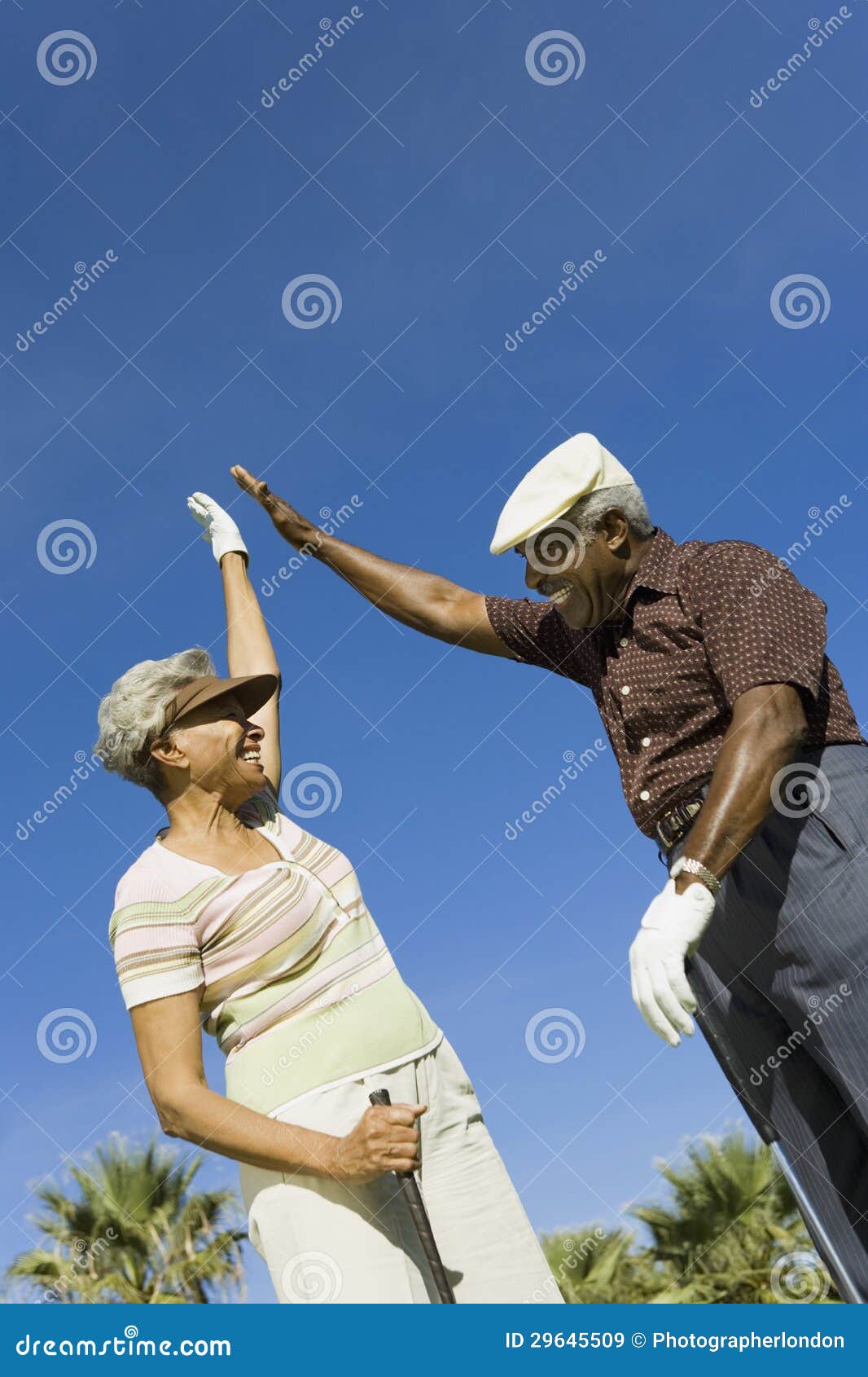 Happy Couple Giving High-Five Stock Image - Image of outdoors, leisure ...