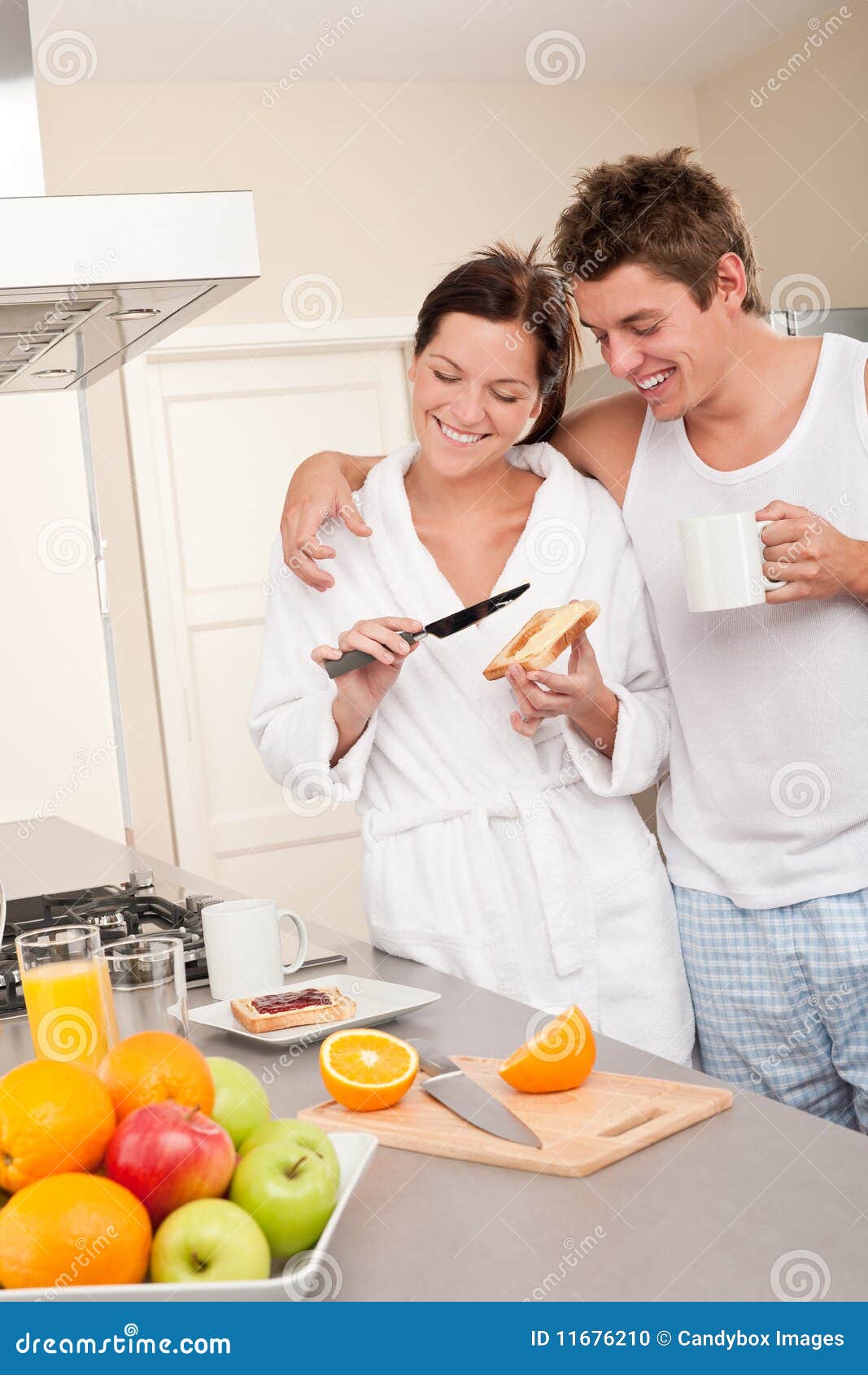 Happy Couple Having Breakfast in the Kitchen Stock Photo - Image of ...