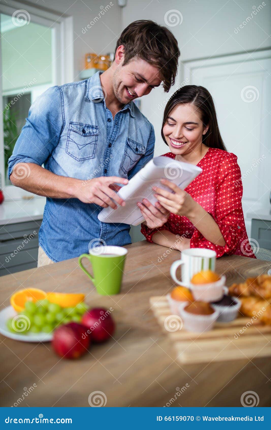 Happy Couple Having Breakfast and Reading Newspaper Stock Photo - Image ...