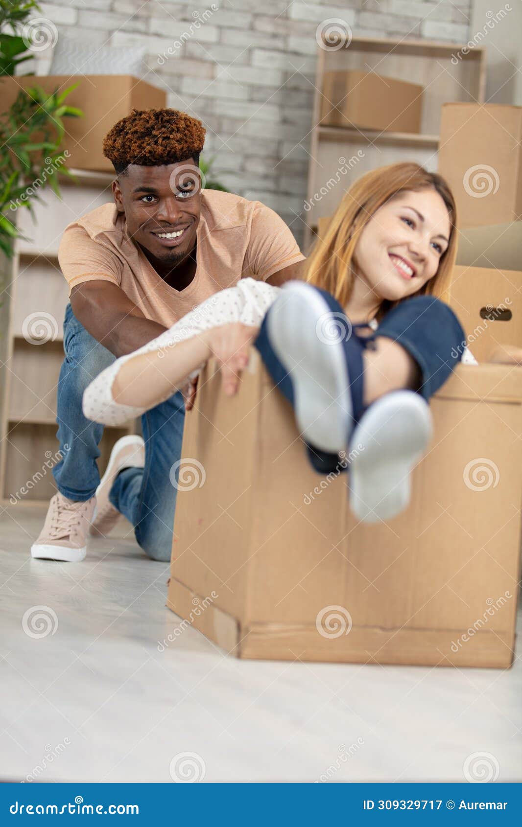 Happy Couple Having Fun Laughing Moving Into New Home Stock Image
