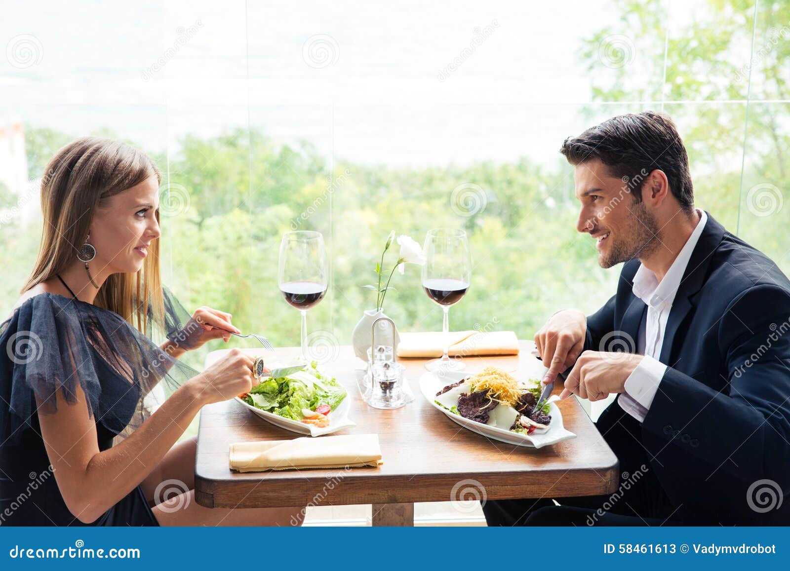 Happy couple having lunch stock image. Image of pretty - 58461613
