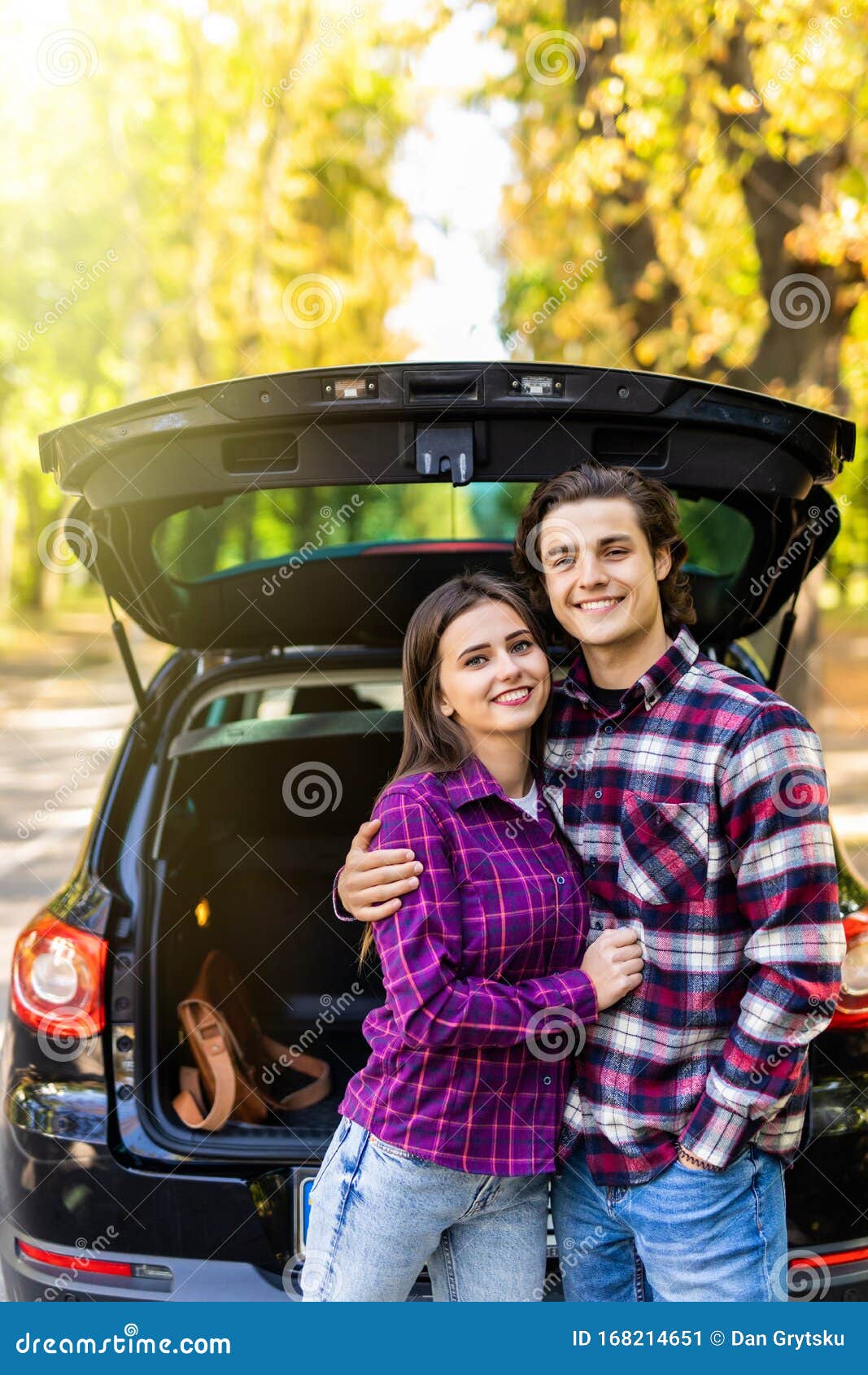 Young Happy Couple Hug on Trunk of Hatchback Car Outdoors Stock Image ...