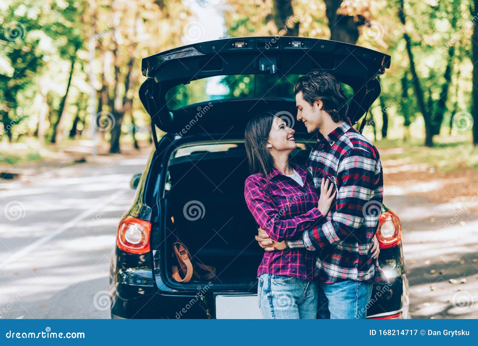 Young Happy Couple Hug on Trunk of Hatchback Car Outdoors Stock Image ...