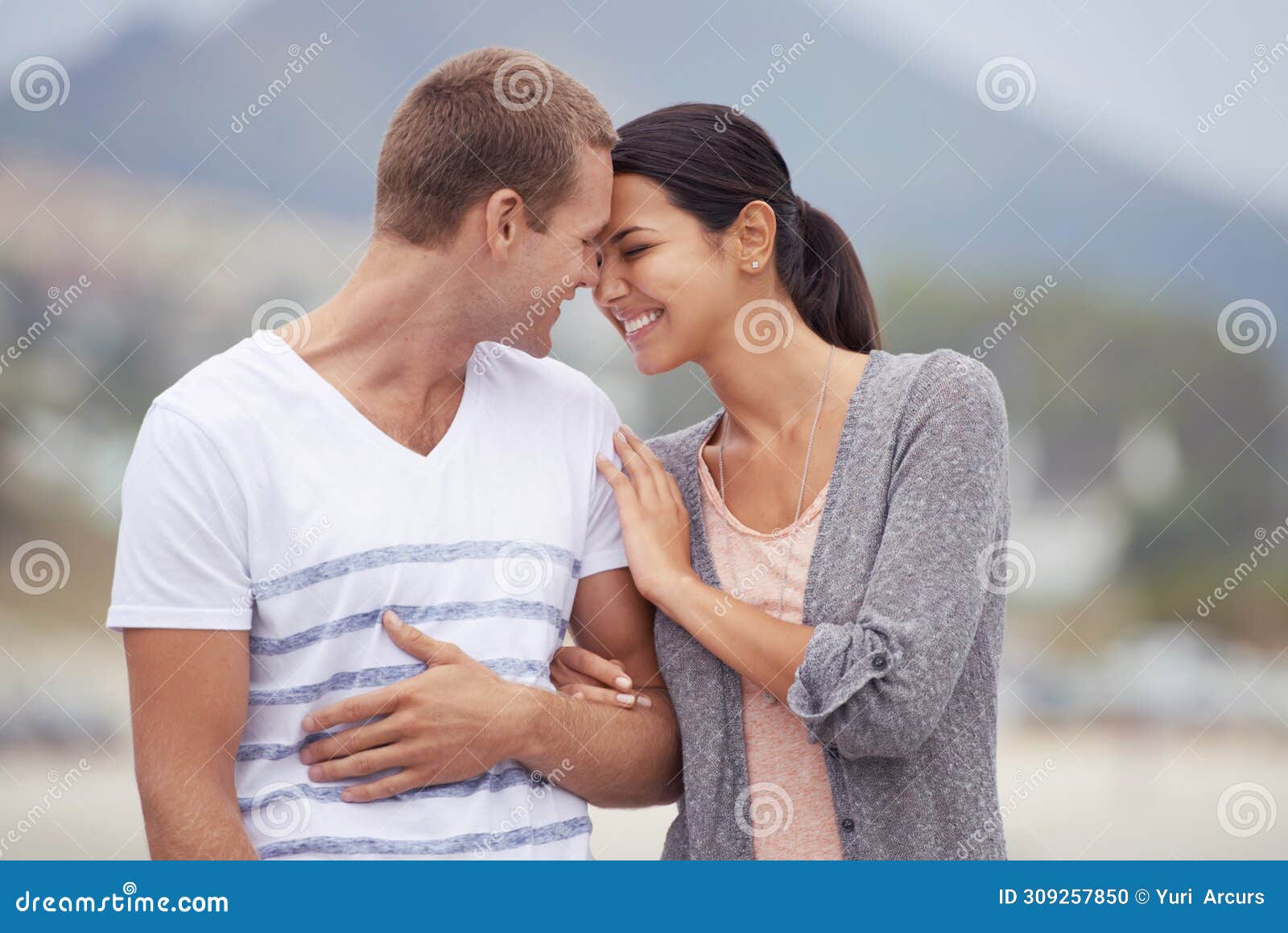 Happy Couple Hug And Walking On The Beach For Travel Forehead Touch