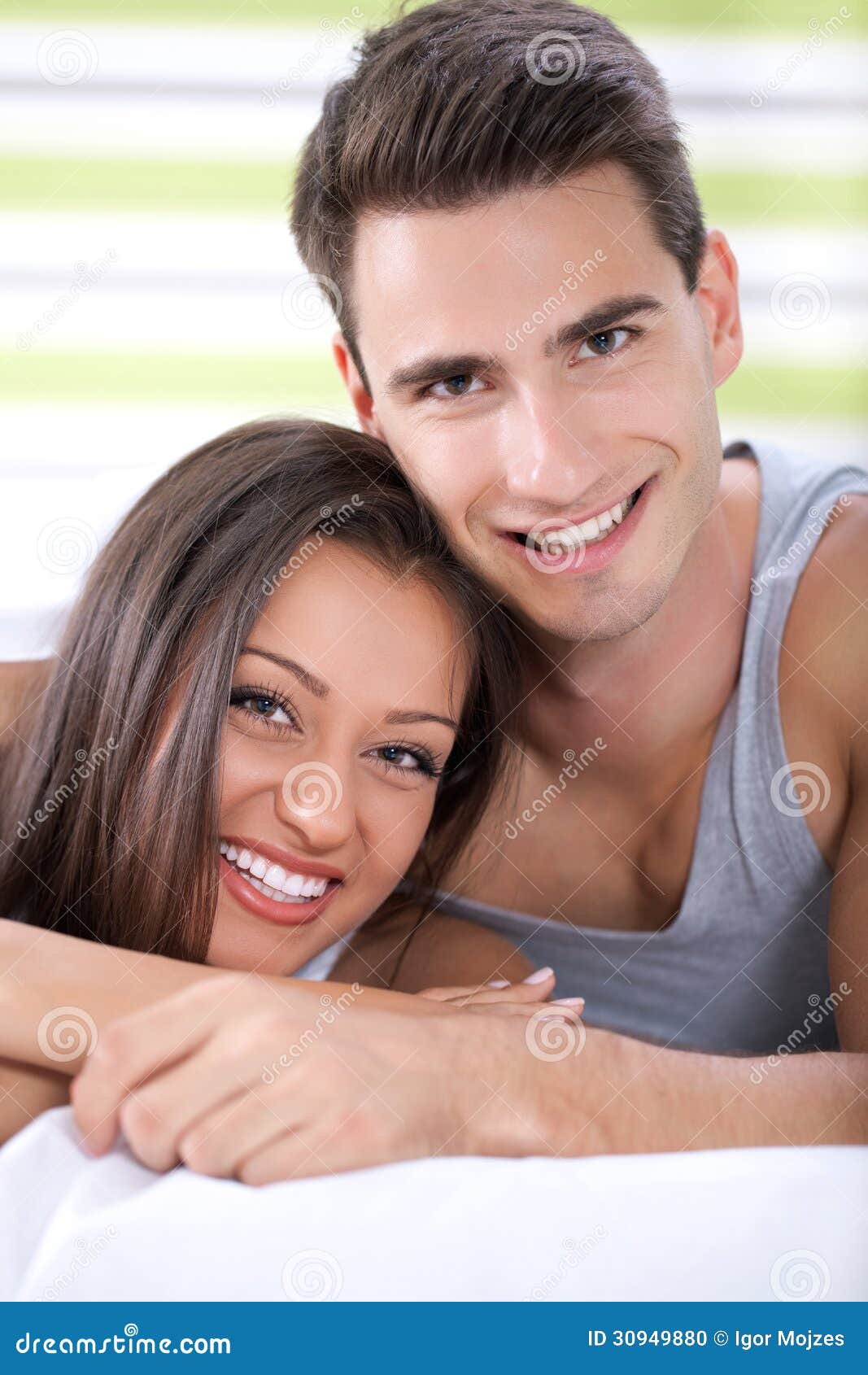 Happy Couple Hugging in Bed Stock Photo - Image of pajamas, feeling ...