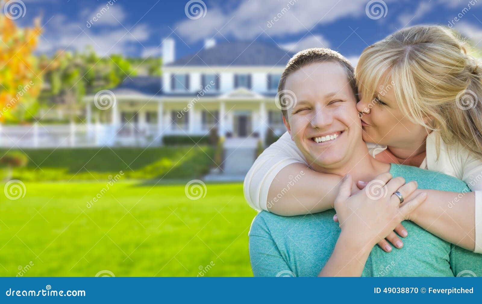 Happy Couple Hugging in Front of House Stock Photo - Image of lady ...