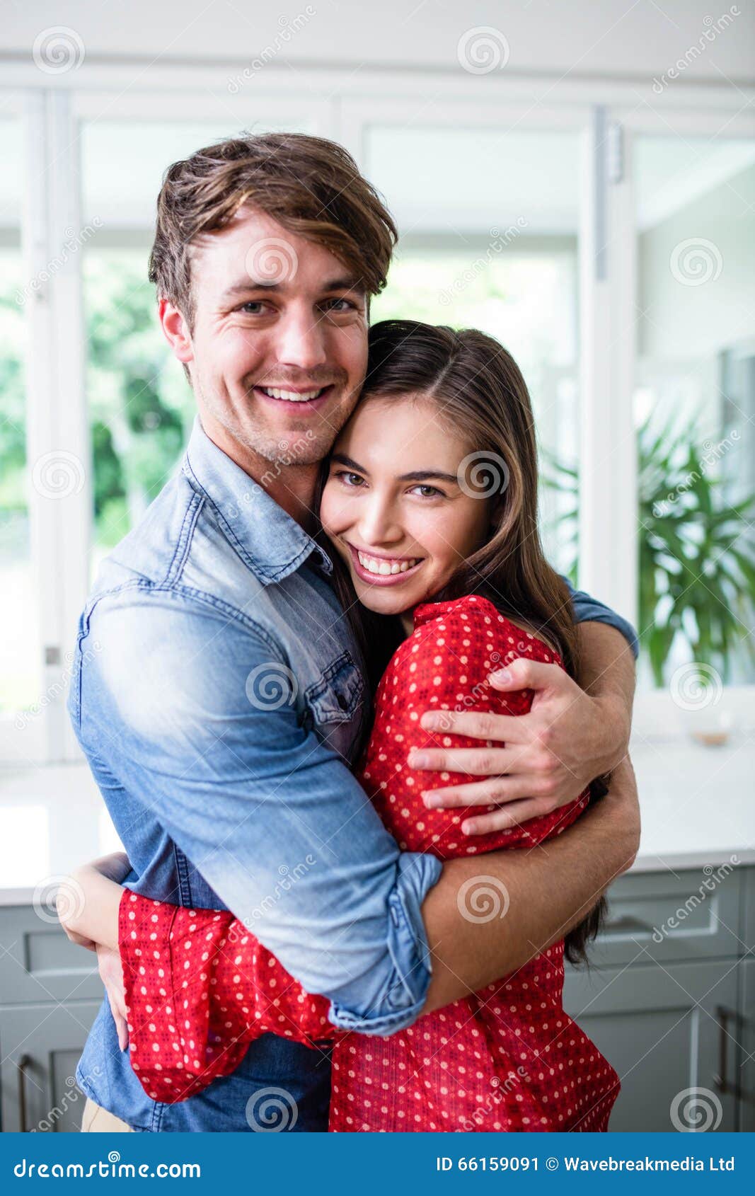 Happy Couple Hugging and Looking at Camera Stock Image - Image of ...