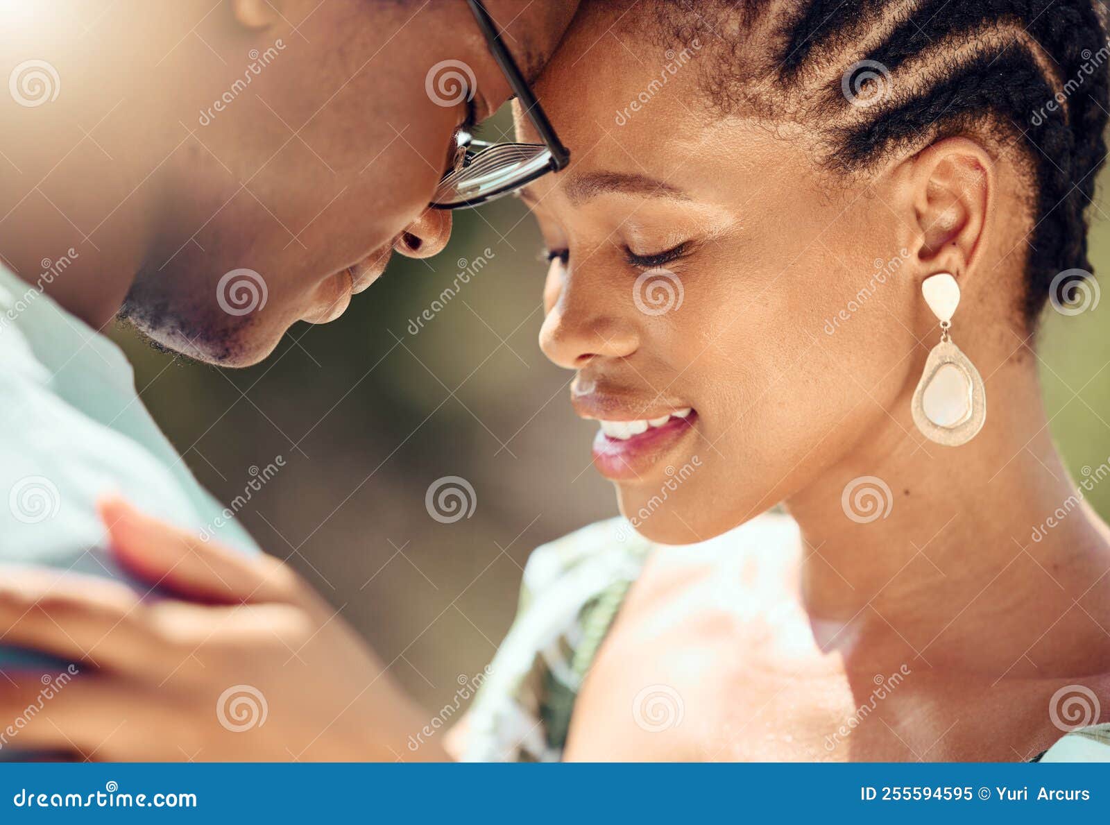 Happy Couple Hugging In Nature While On A Romantic Date While Bonding