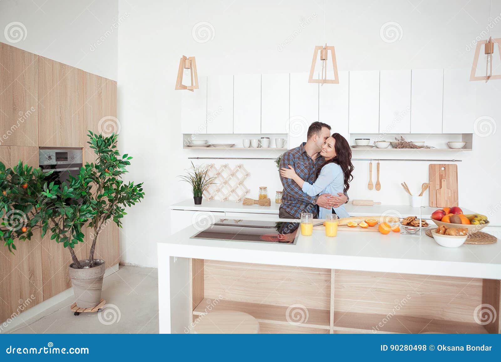 Happy Couple Hugging in the White Loft Stile Kitchen Stock Photo ...
