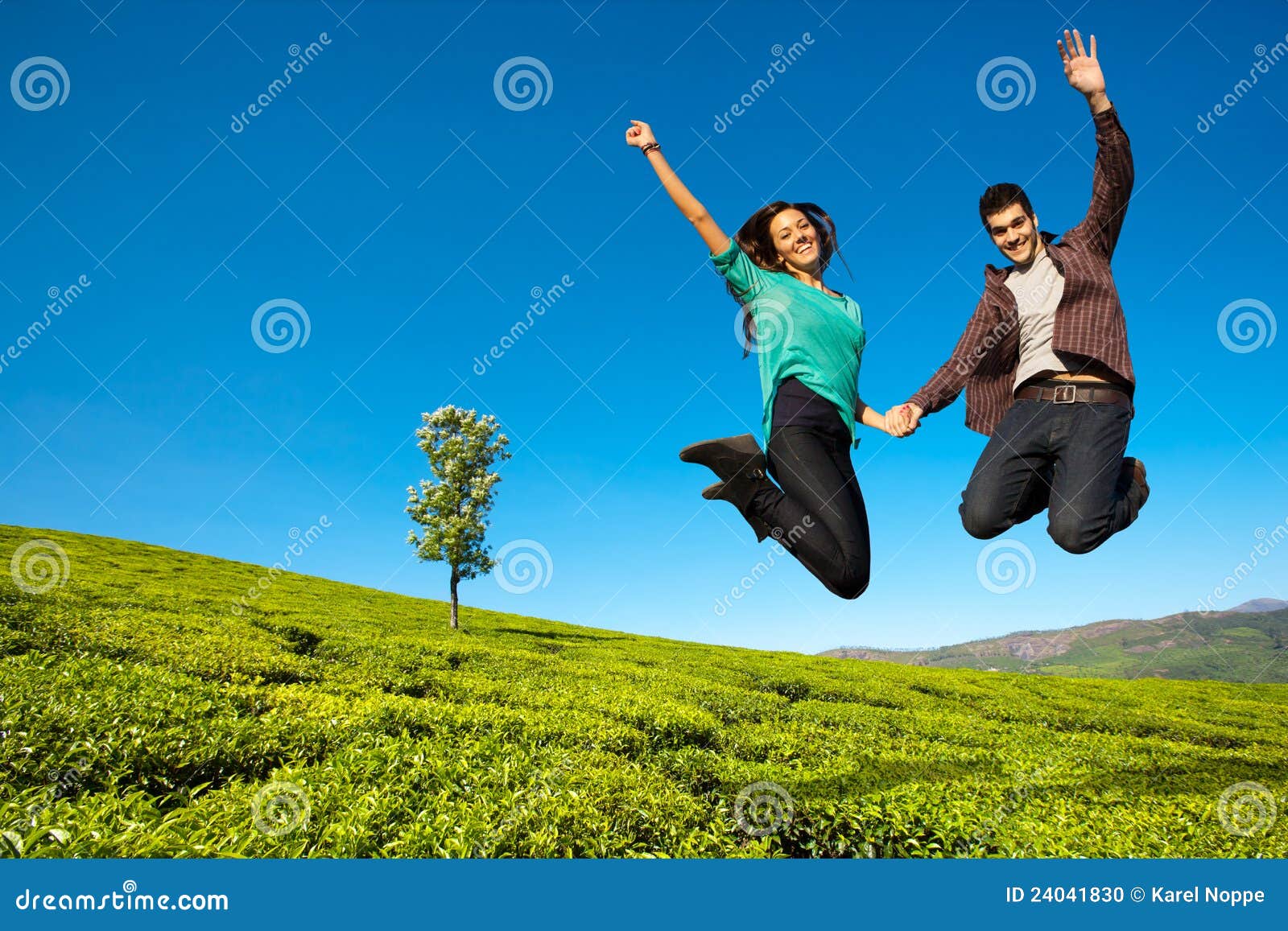 Happy couple jumping high stock photo. Image of fashion - 24041830