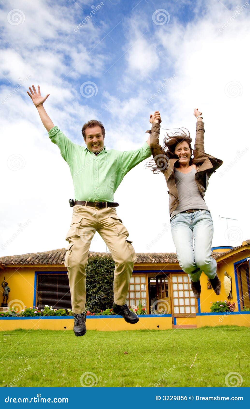 Happy Couple Jumping of Joy Stock Photo - Image of hands, forties: 3229856