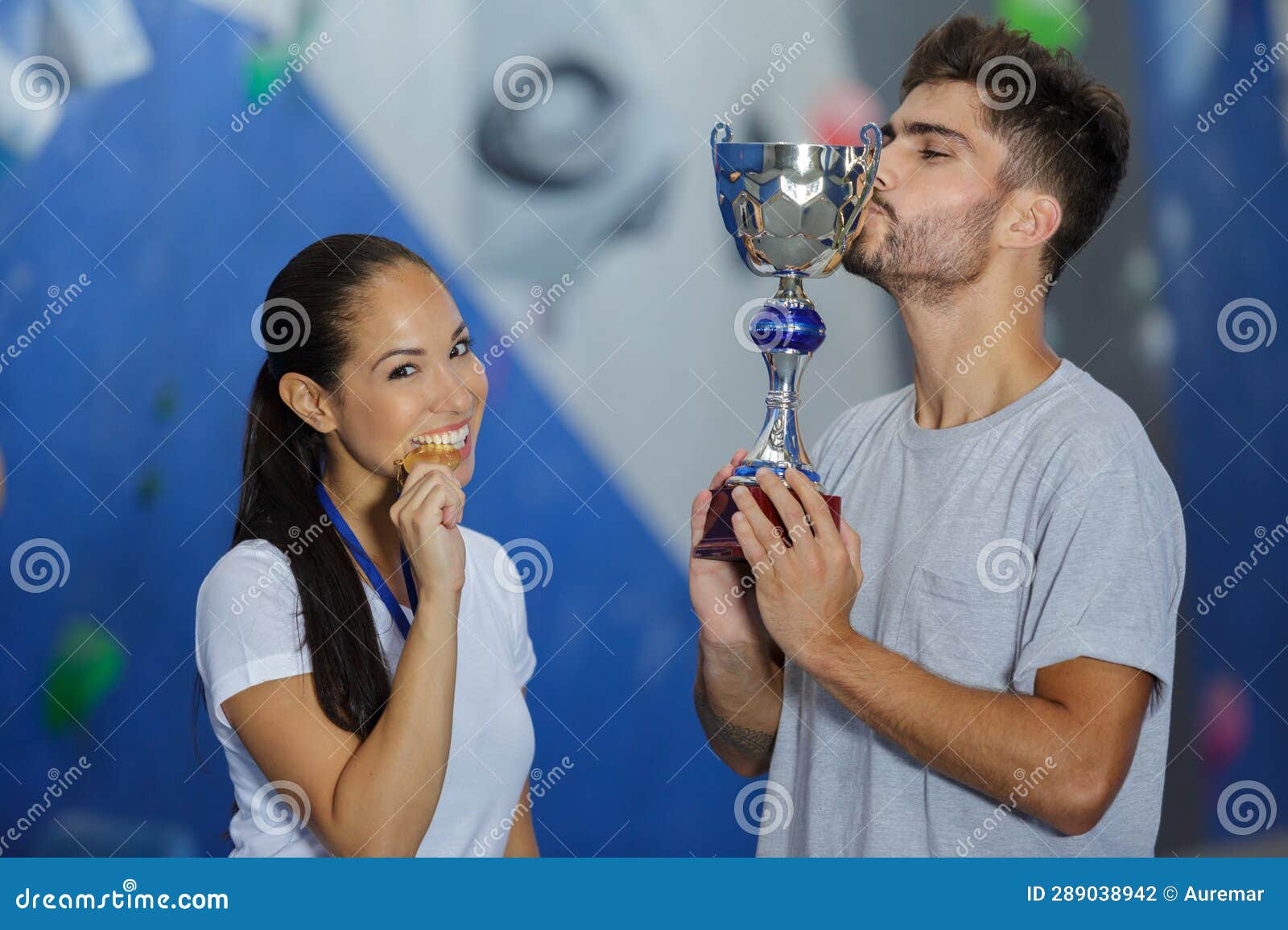 Happy couple kisses trophy stock photo. Image of person - 289038942