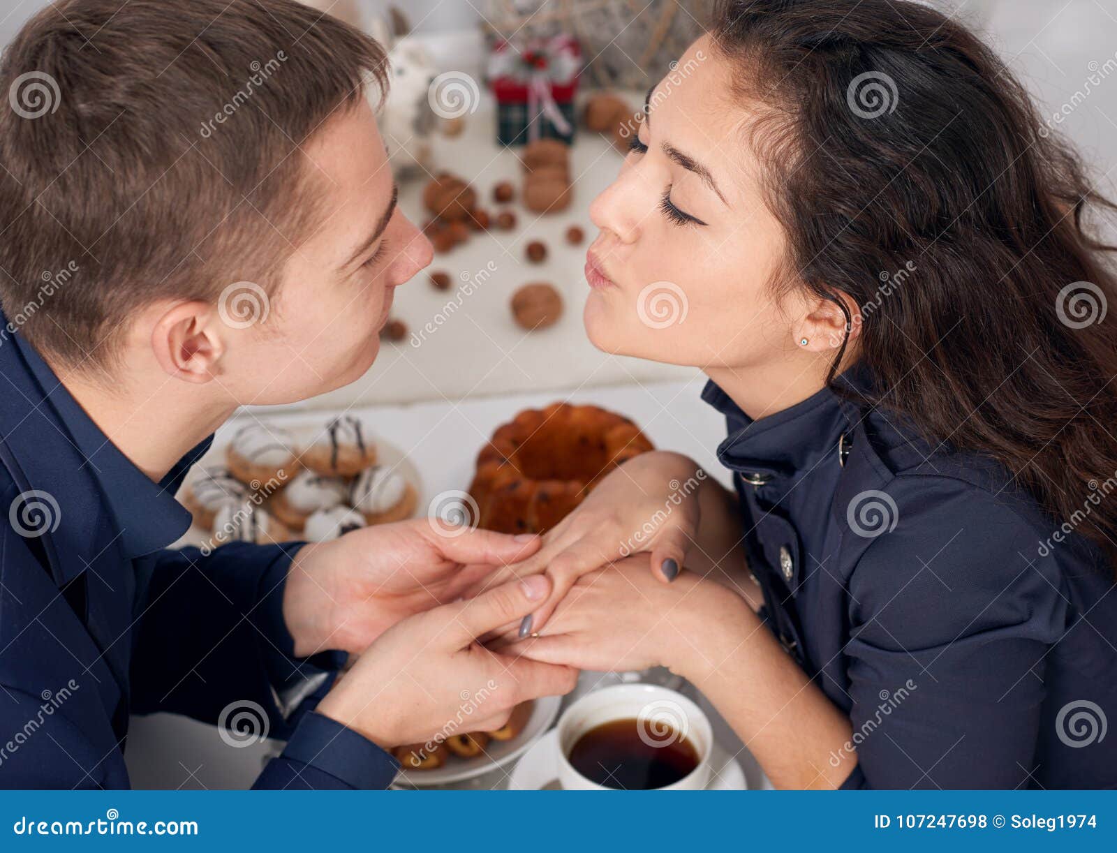 Happy Couple Kissing and Drinking Tea Indoor Stock Photo - Image of ...