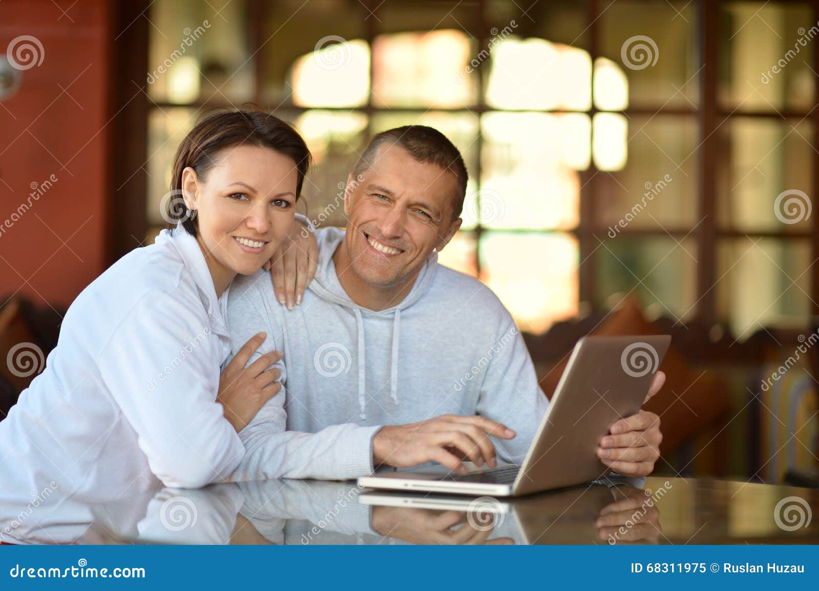 Happy couple with laptop stock image. Image of computer - 68311975