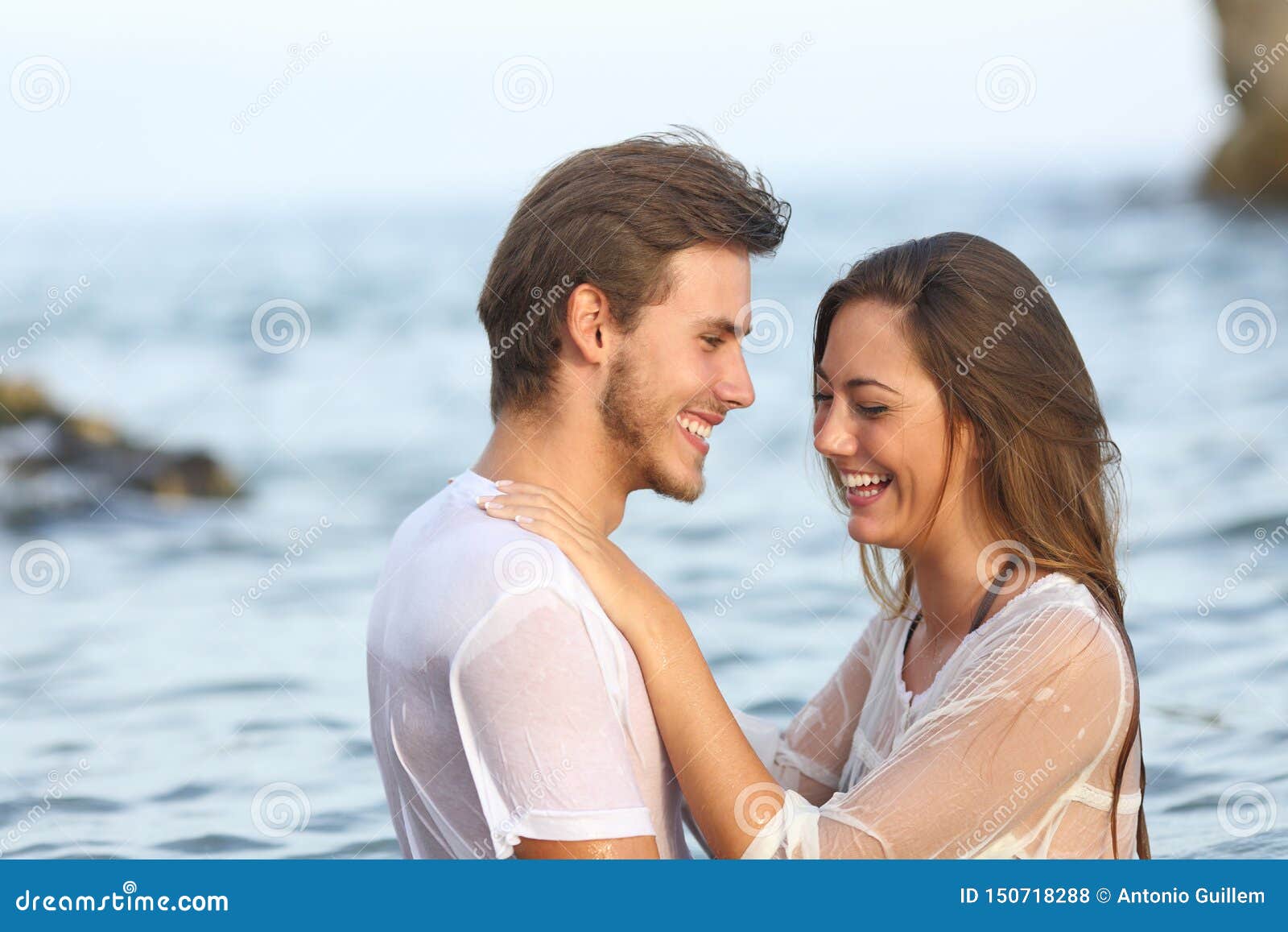 Happy Couple Laughing Bathing on the Beach Stock Photo - Image of ...