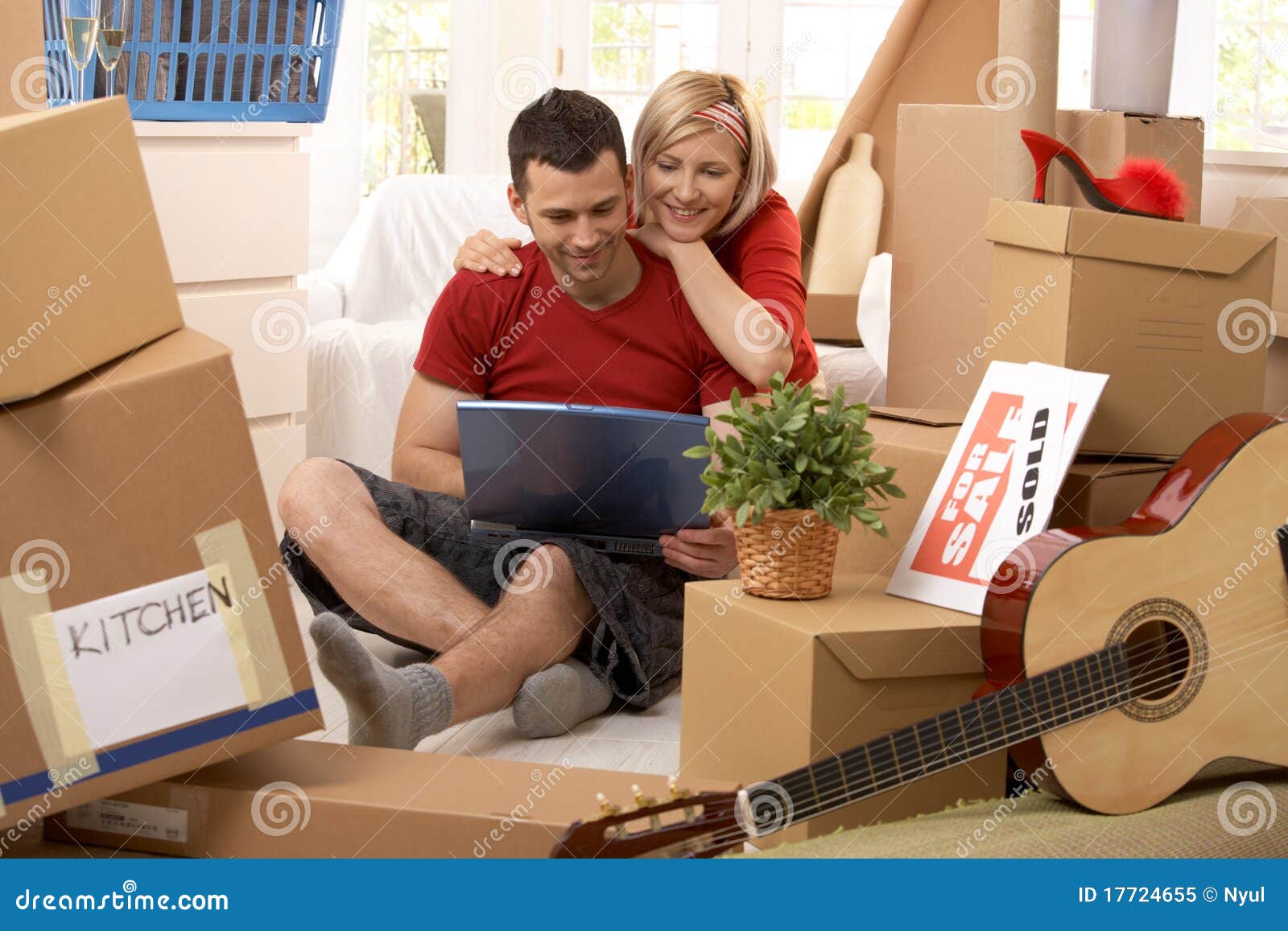 Happy Couple Looking at Computer in New House Stock Image - Image of ...