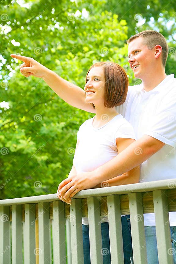 Happy Couple Looking Over stock photo. Image of heart - 6839234