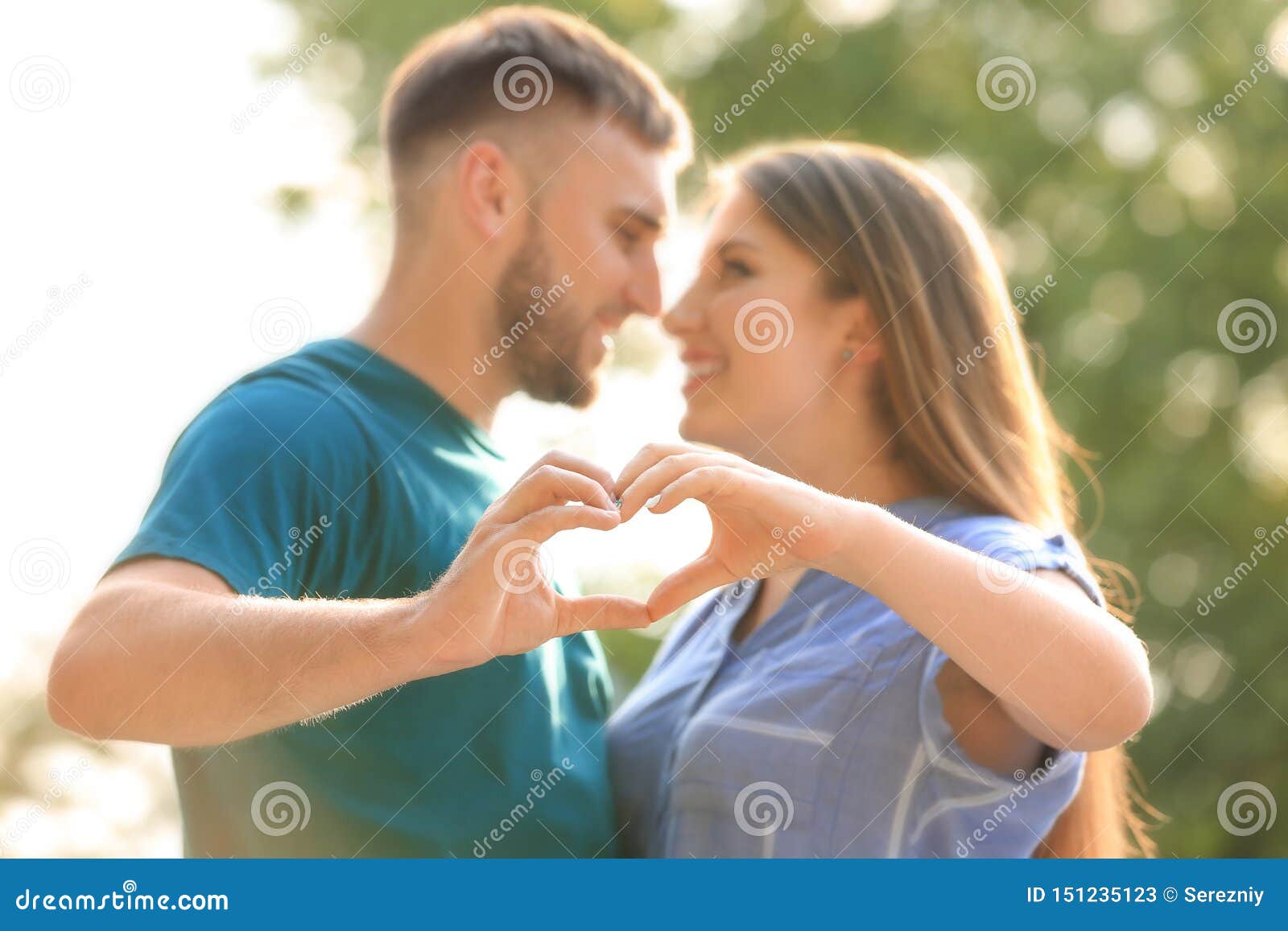 Happy Couple Making Heart with Their Hands Outdoors Stock Image - Image ...