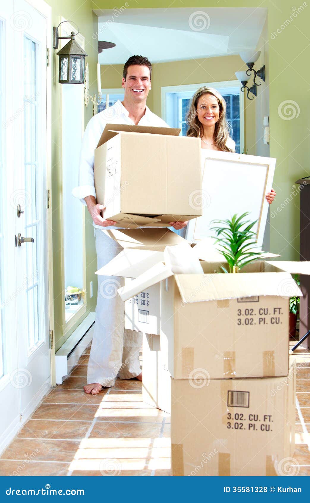Happy Couple Moving in a New House. Stock Photo - Image of beautiful ...