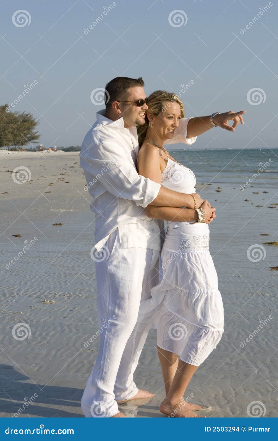 Happy couple at the ocean. stock photo. Image of island - 2503294