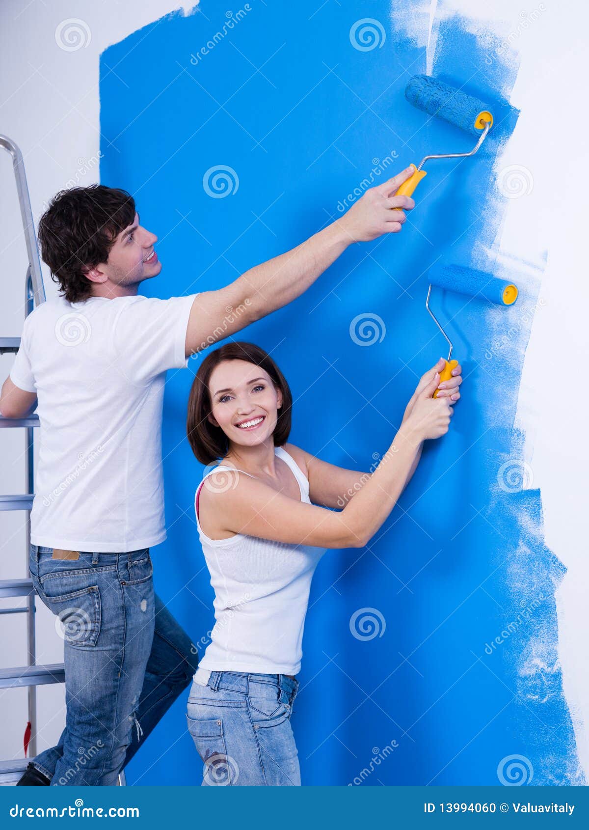 Happy Couple Painting the Wall Stock Photo - Image of paintbrush ...