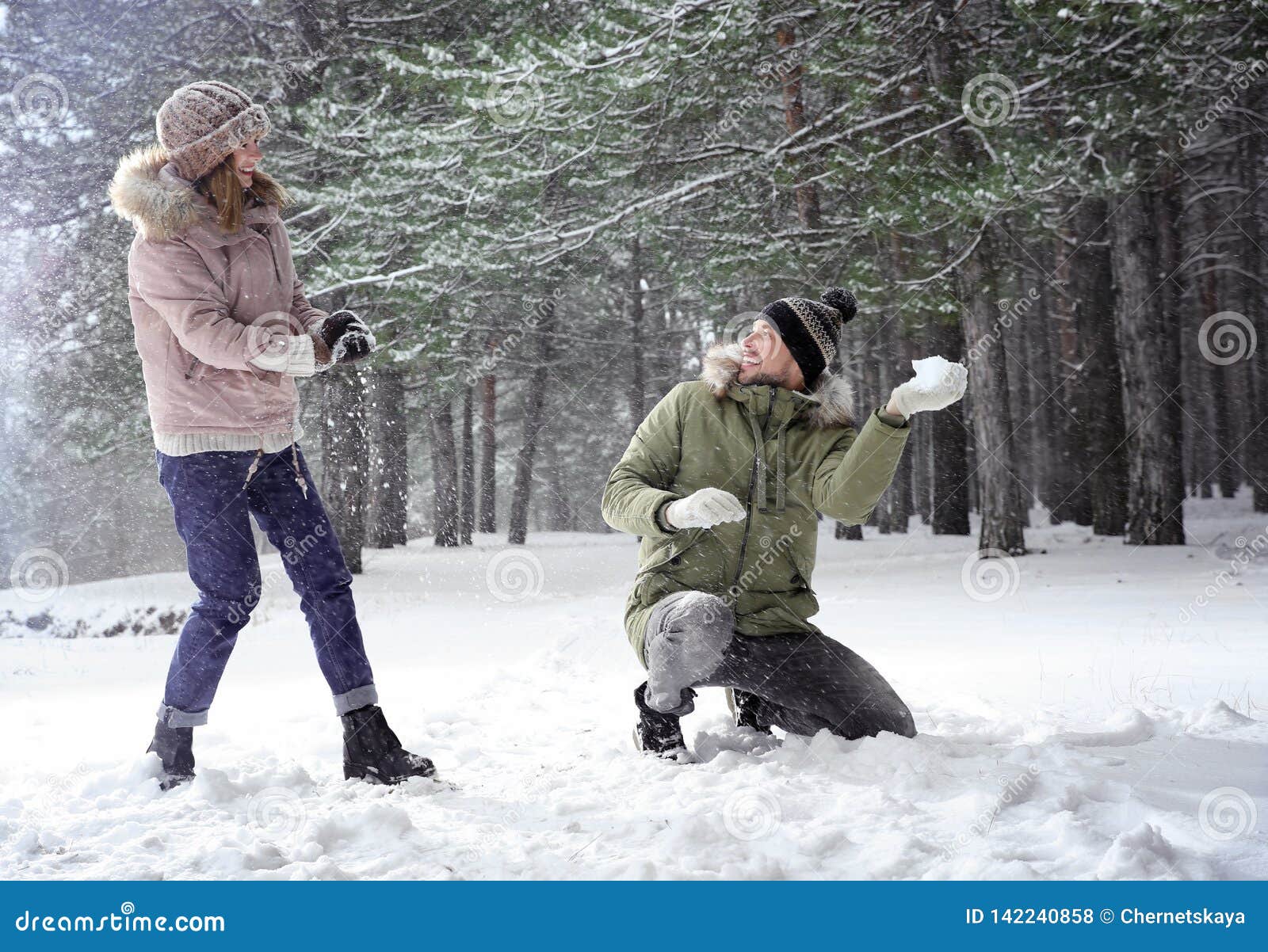 Happy Couple Playing Snowballs Stock Photo - Image of life, christmas ...