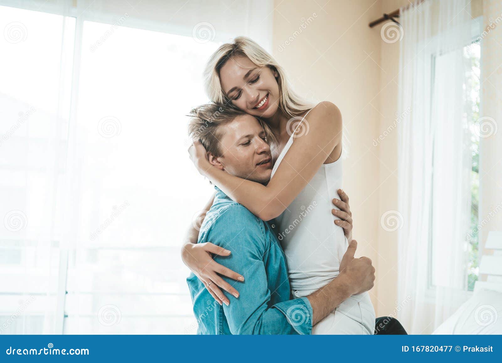 Happy Couple Playing Together Stock Image - Image of room, love: 167820477