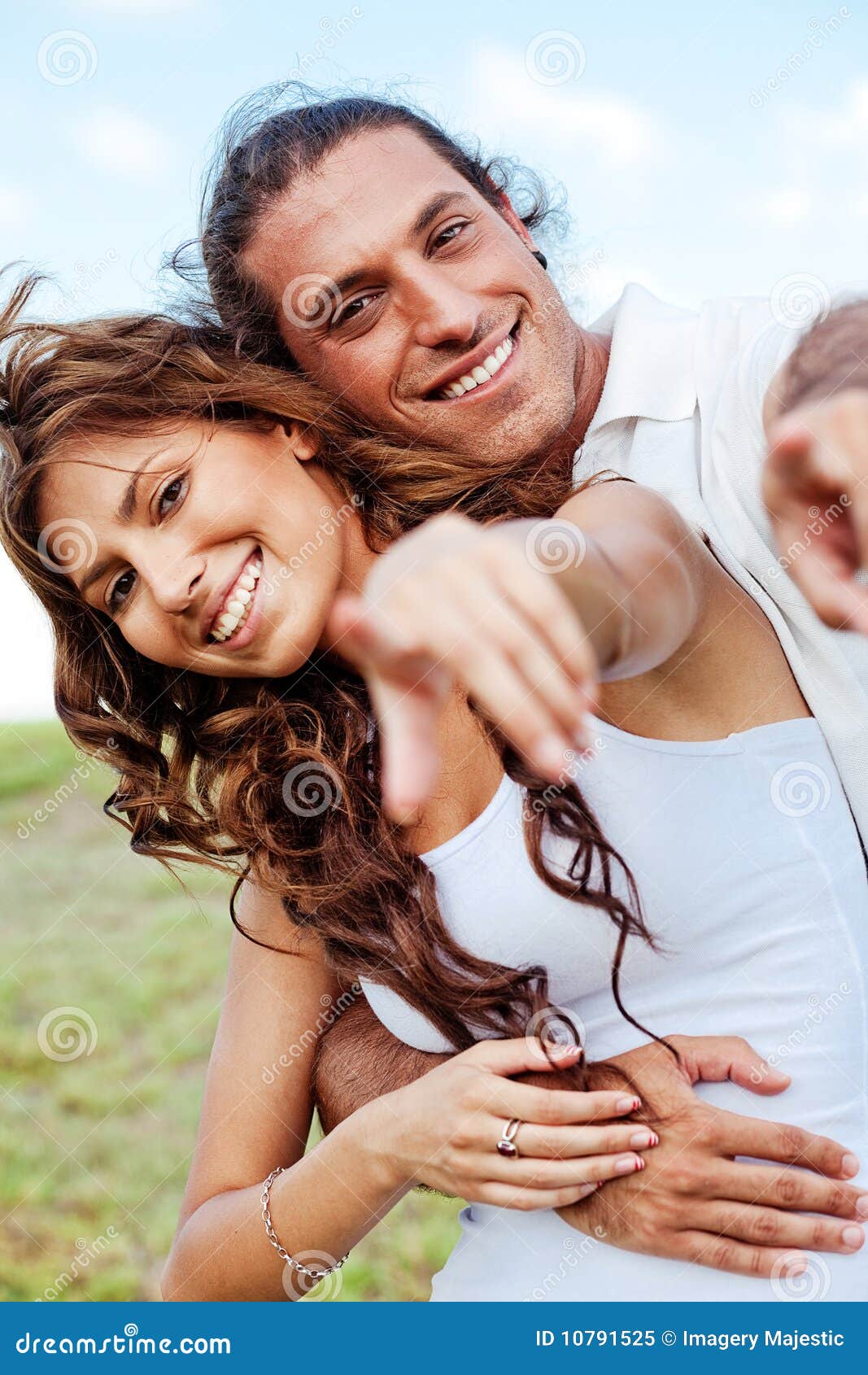 Happy Couple Pointing Towards Camera Stock Image - Image of casual ...