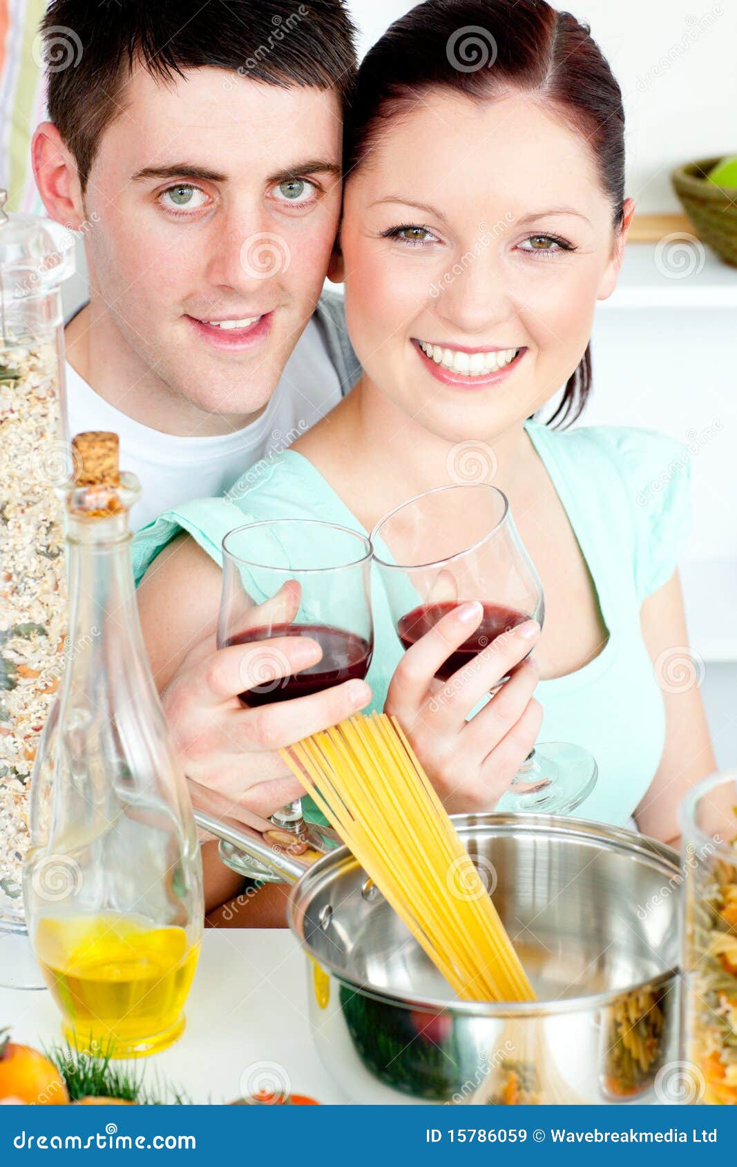 Happy Couple Preparing Spaghetti and Drinking Wine Stock Image - Image ...