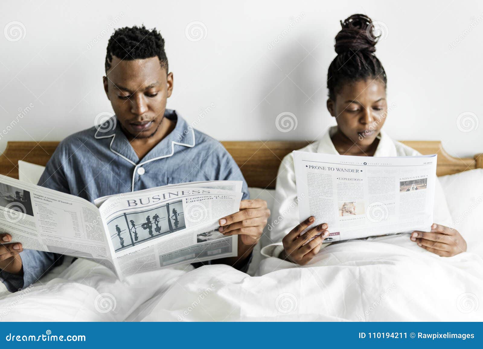 A Happy Couple Reading Newspaper in Bed Stock Image - Image of female ...