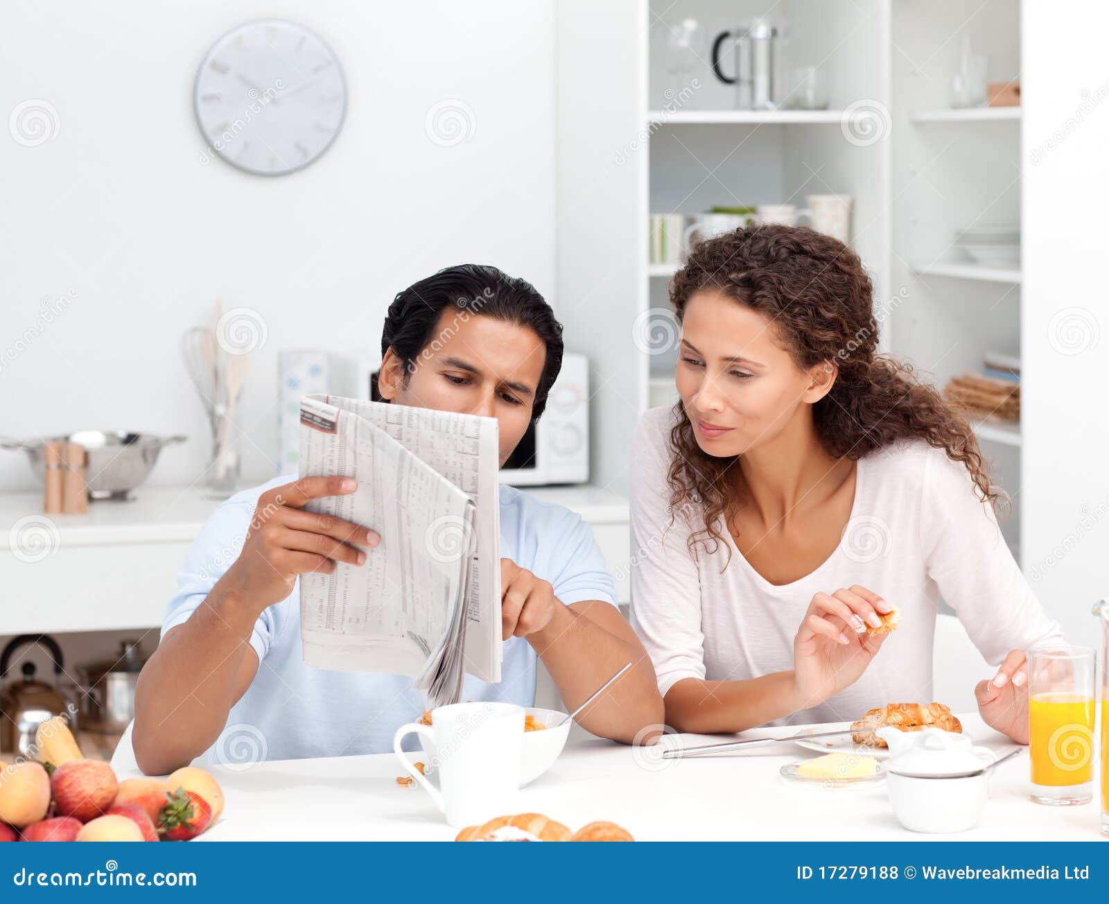 Happy Couple Reading the Newspaper at Breakfast Stock Photo - Image of ...