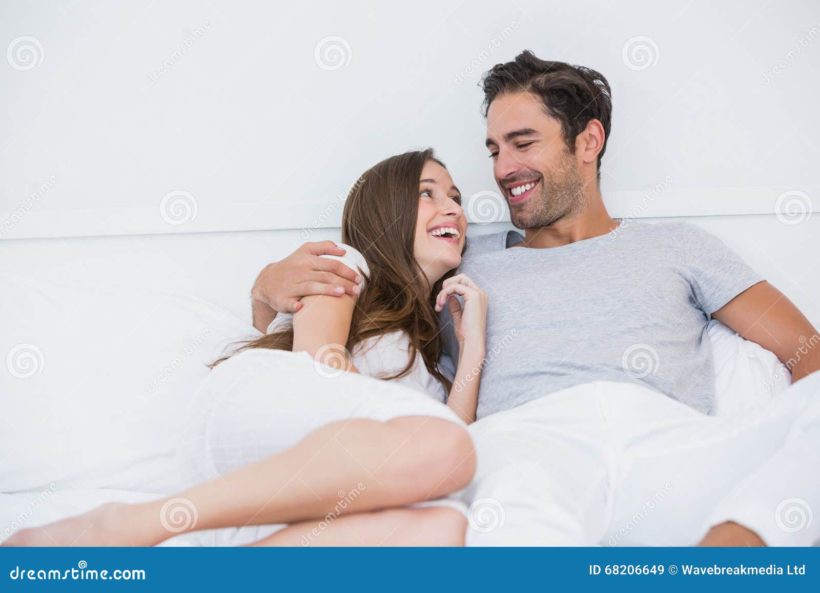 Happy Couple Relaxing on Bed Stock Image - Image of quarter, bedroom ...