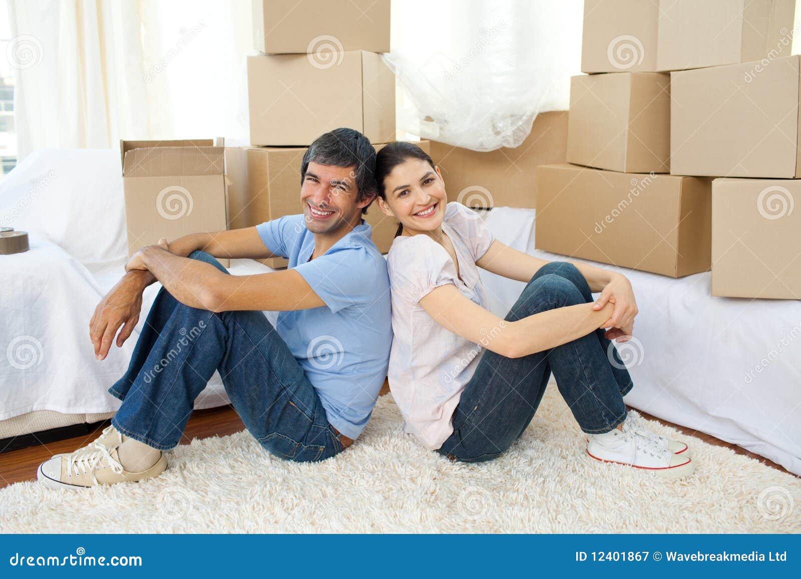 Happy Couple Relaxing while Moving House Stock Image - Image of male ...