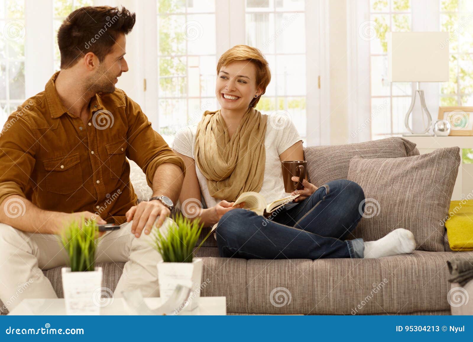 Happy Couple Resting on Sofa Stock Image - Image of hair, enjoy: 95304213