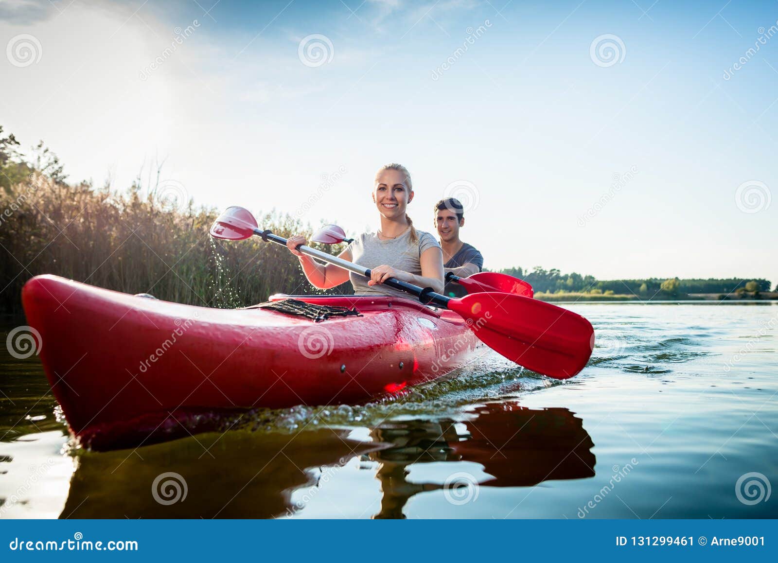 Couple Rowing Kayak on Lake Stock Image - Image of caucasian, bonding ...