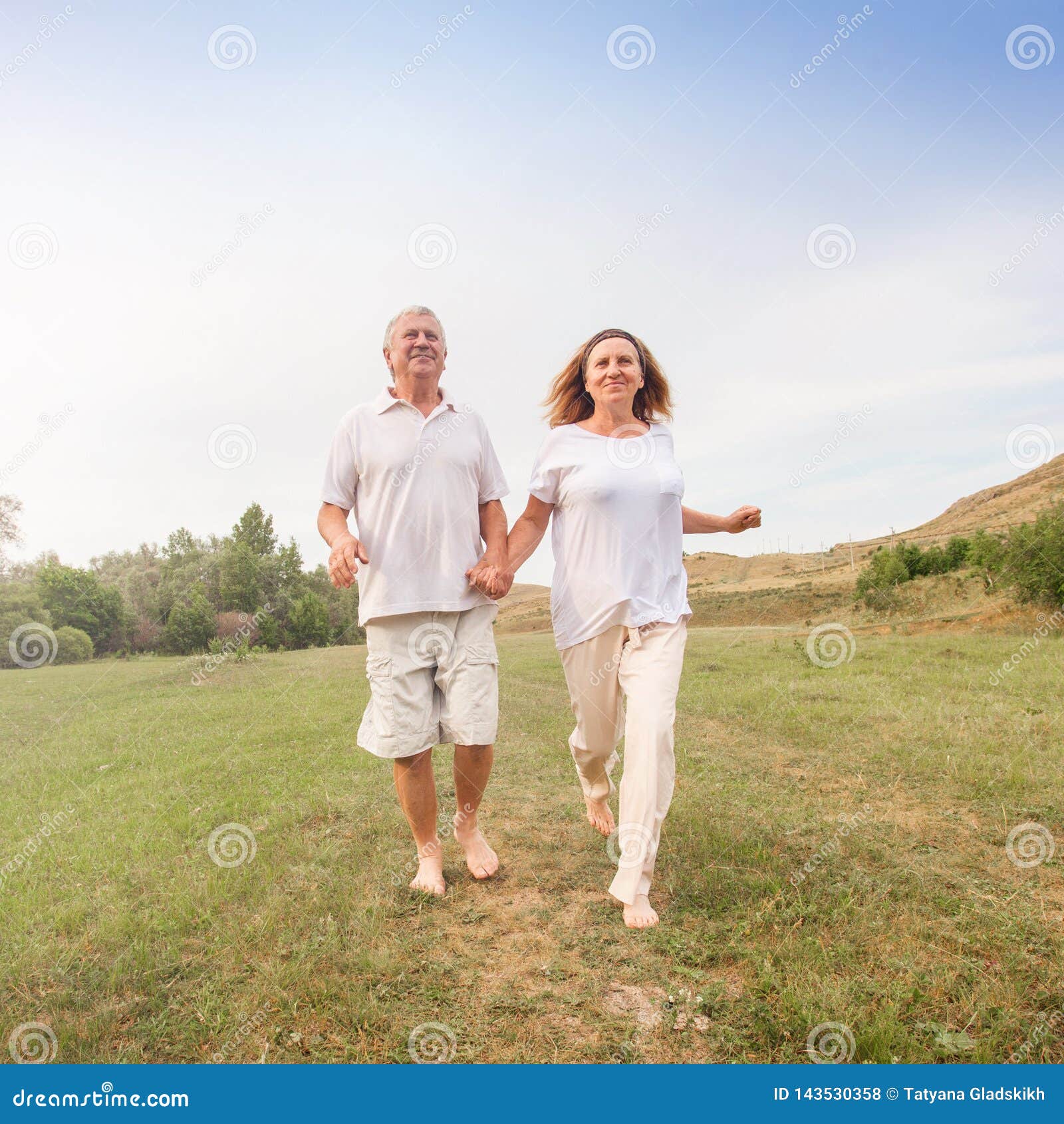 Happy couple running stock photo. Image of adult, active - 143530358