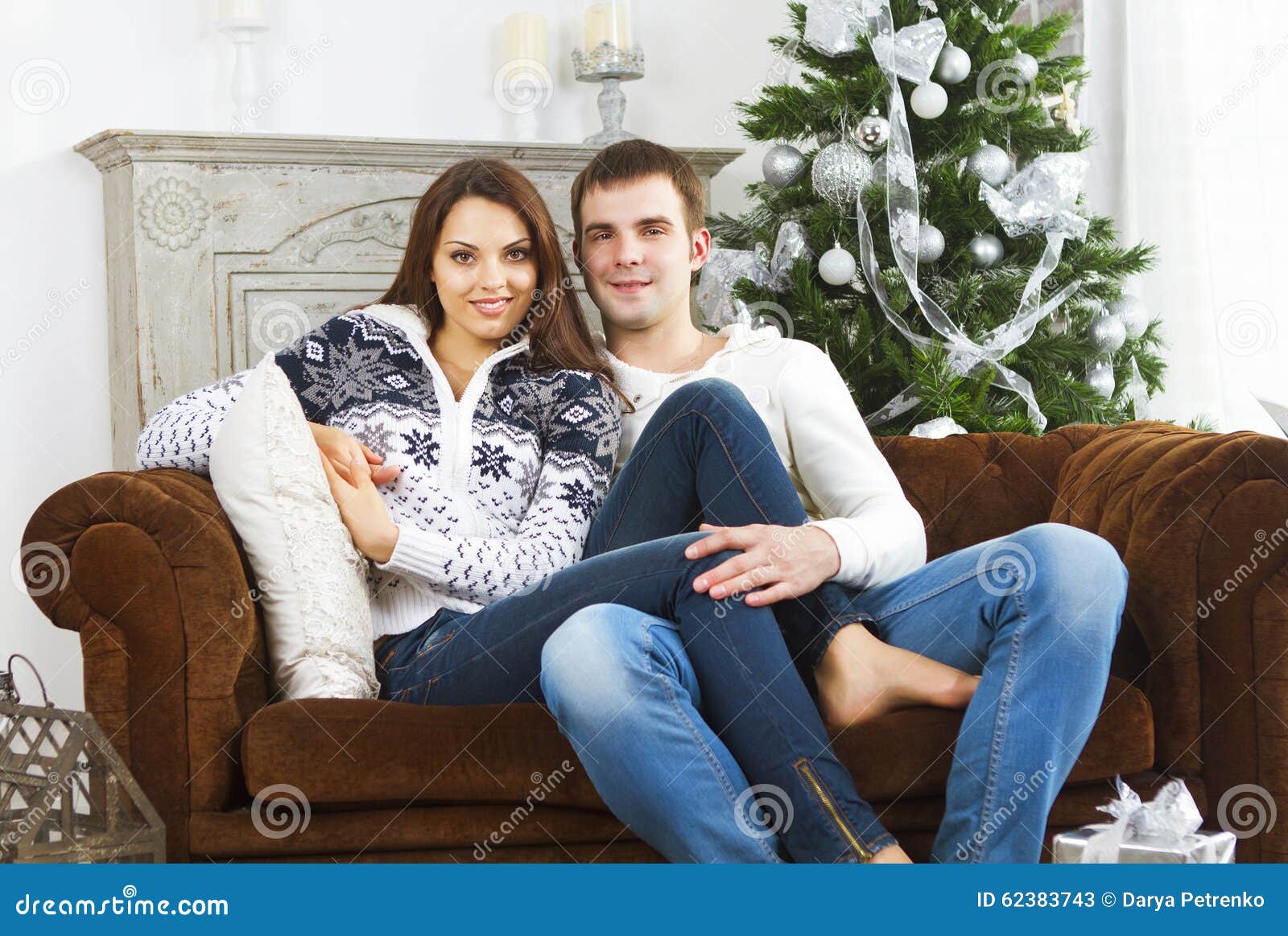 Happy Couple Sitting on the Sofa by Christmas Tree Stock Image - Image ...