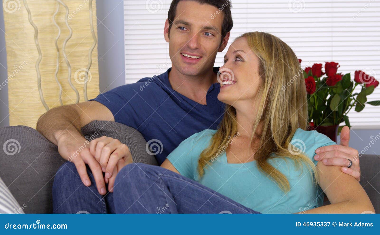 Happy Couple Sitting Together on Couch Stock Image - Image of casual ...