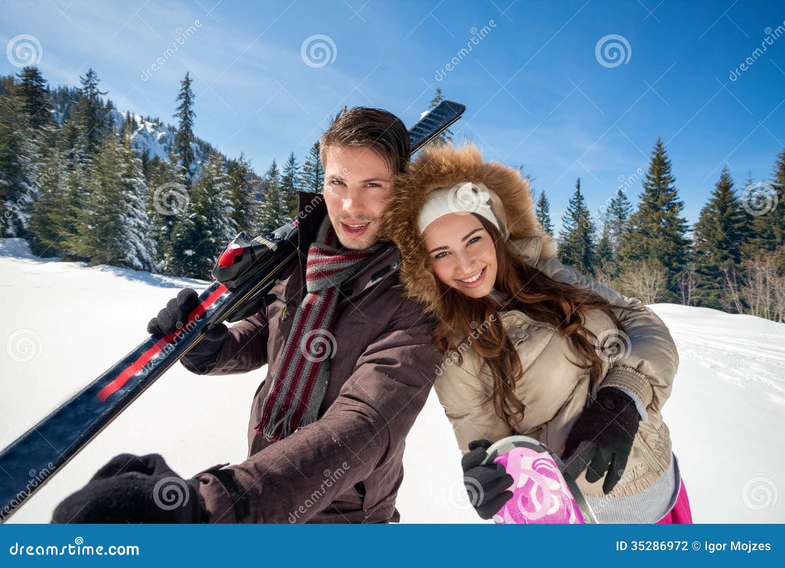 Happy couple on ski stock photo. Image of male, recreation - 35286972