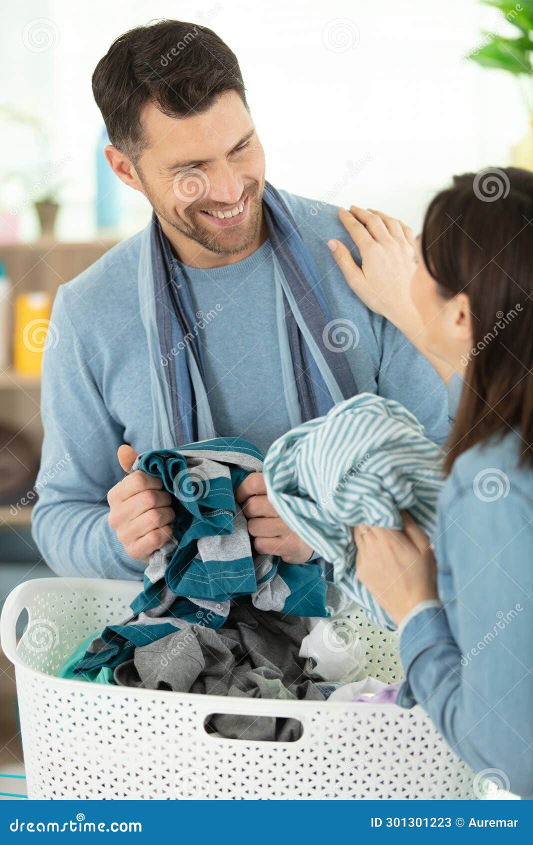 Happy Couple Sorting Laundry Togather Stock Image - Image of midadult ...