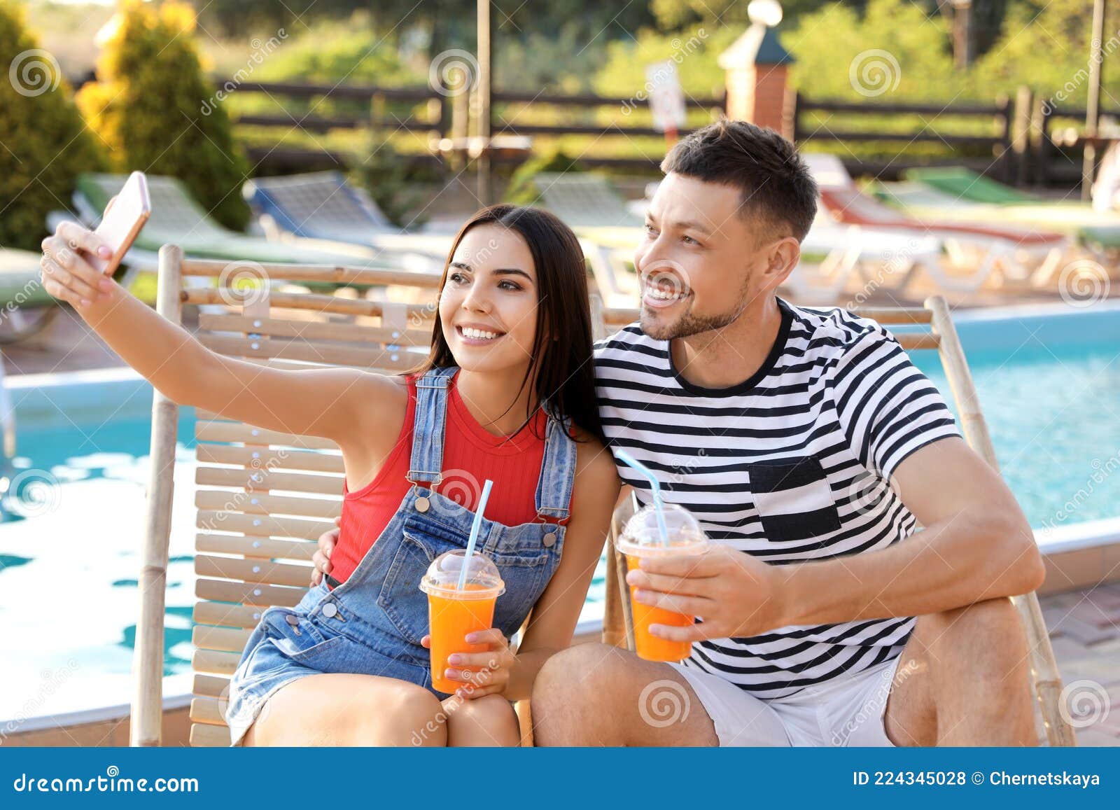Happy Couple Taking Selfie in Deck Chairs Stock Photo - Image of ...