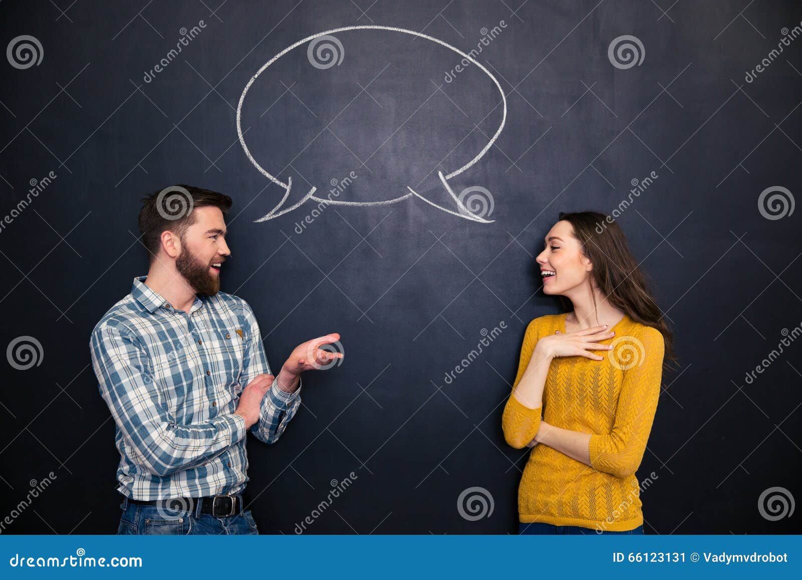 Happy Couple Talking Over Chalkboard Background with Drawn Dialogue ...