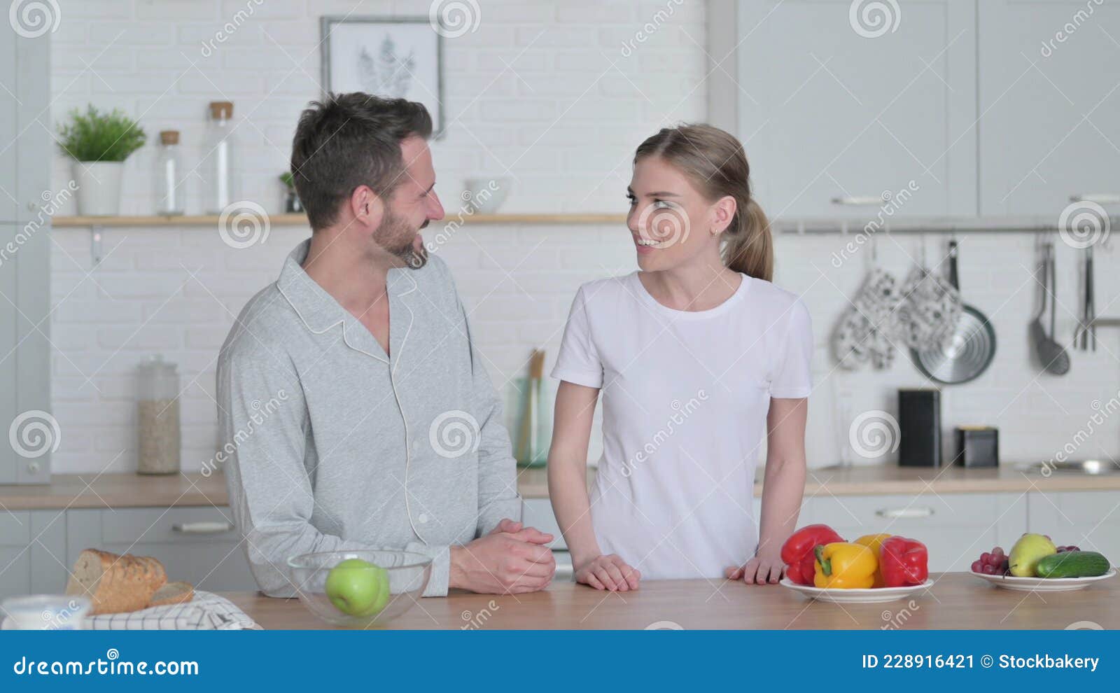Happy Couple Talking while Standing in Kitchen Stock Image - Image of ...